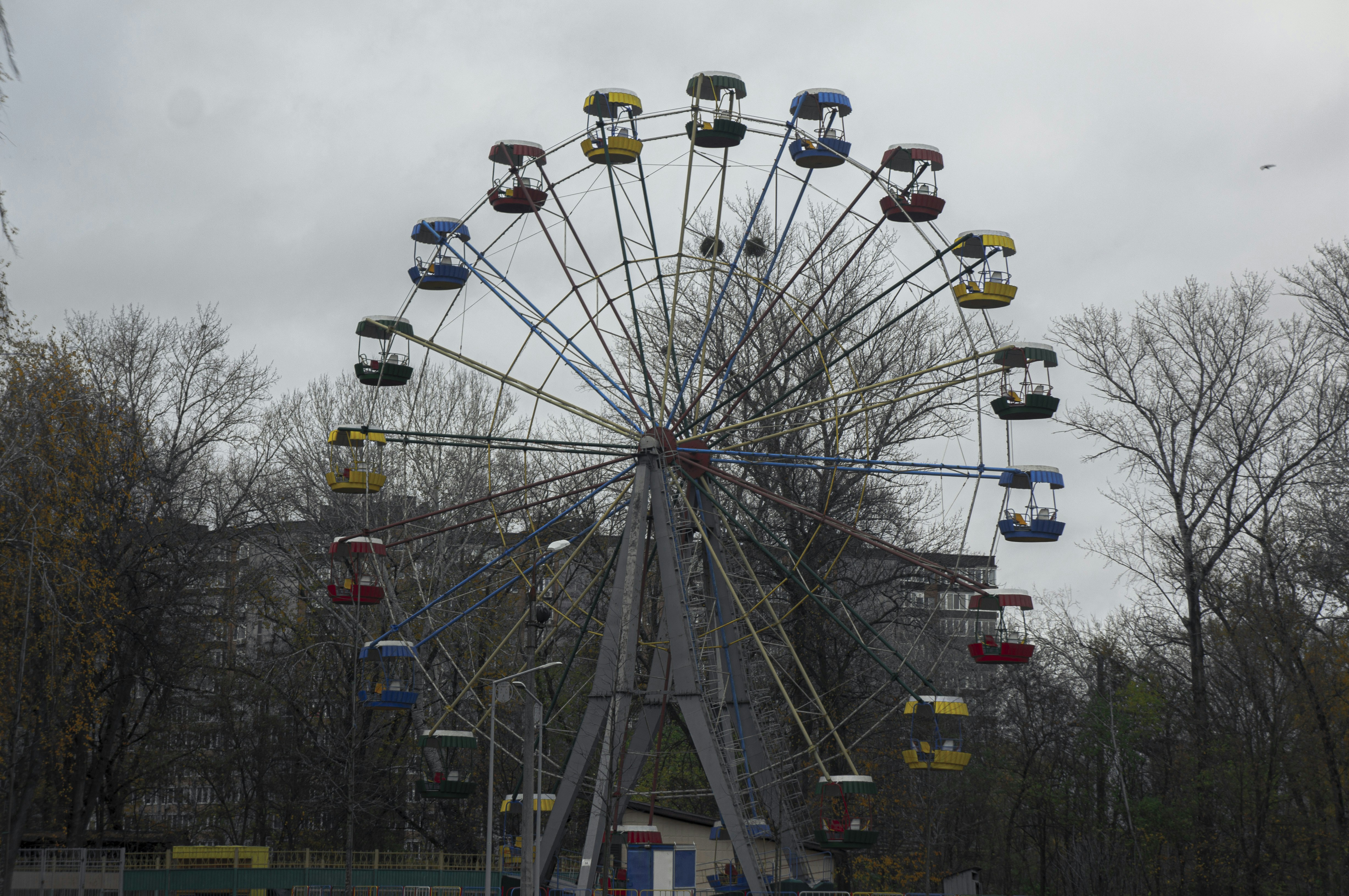 Colorful Ferris Wheel Quietly Dominates a Gray Winter Park