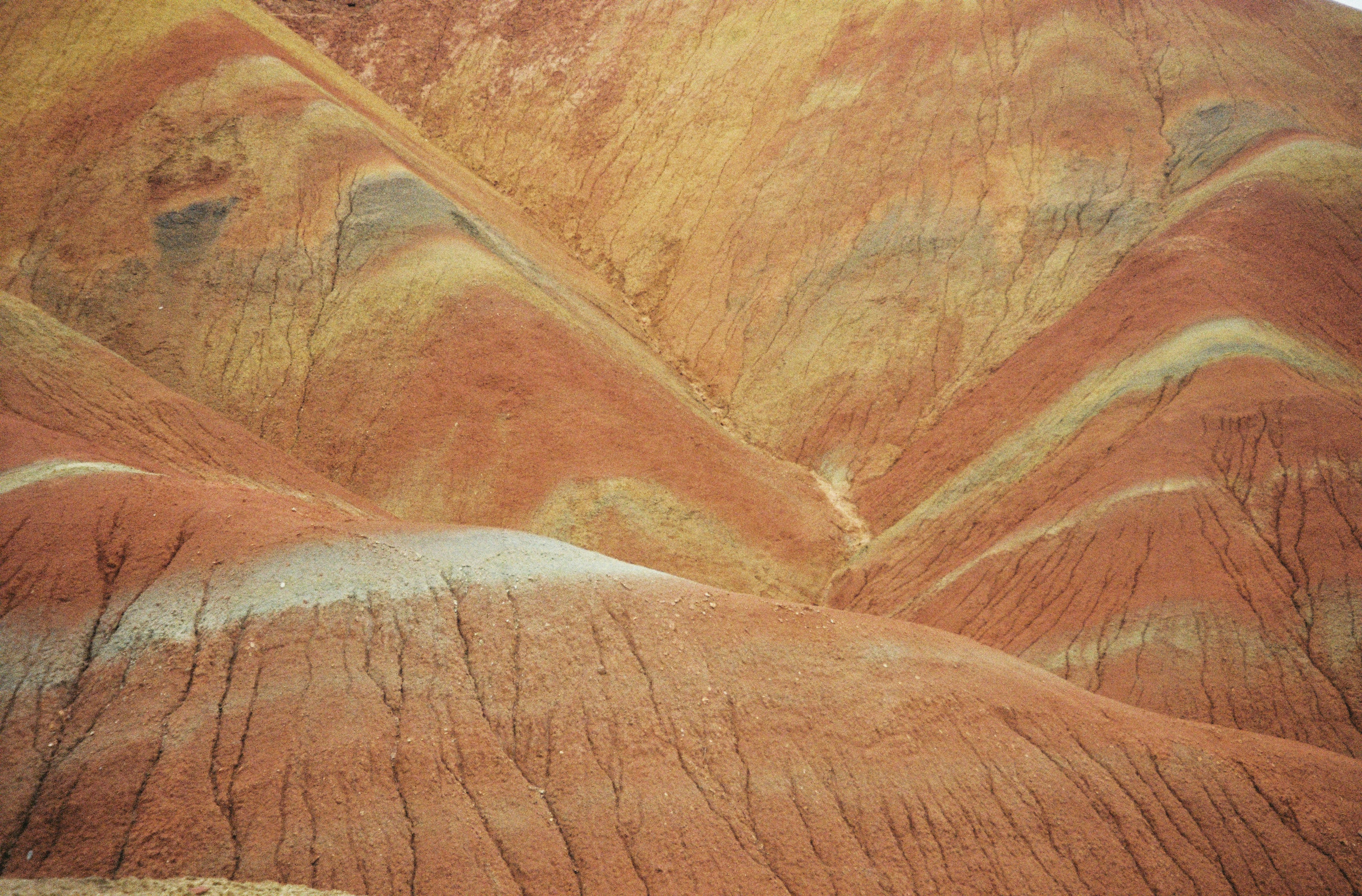 A group of hills with a sky in the background photo – Free Linze county ...