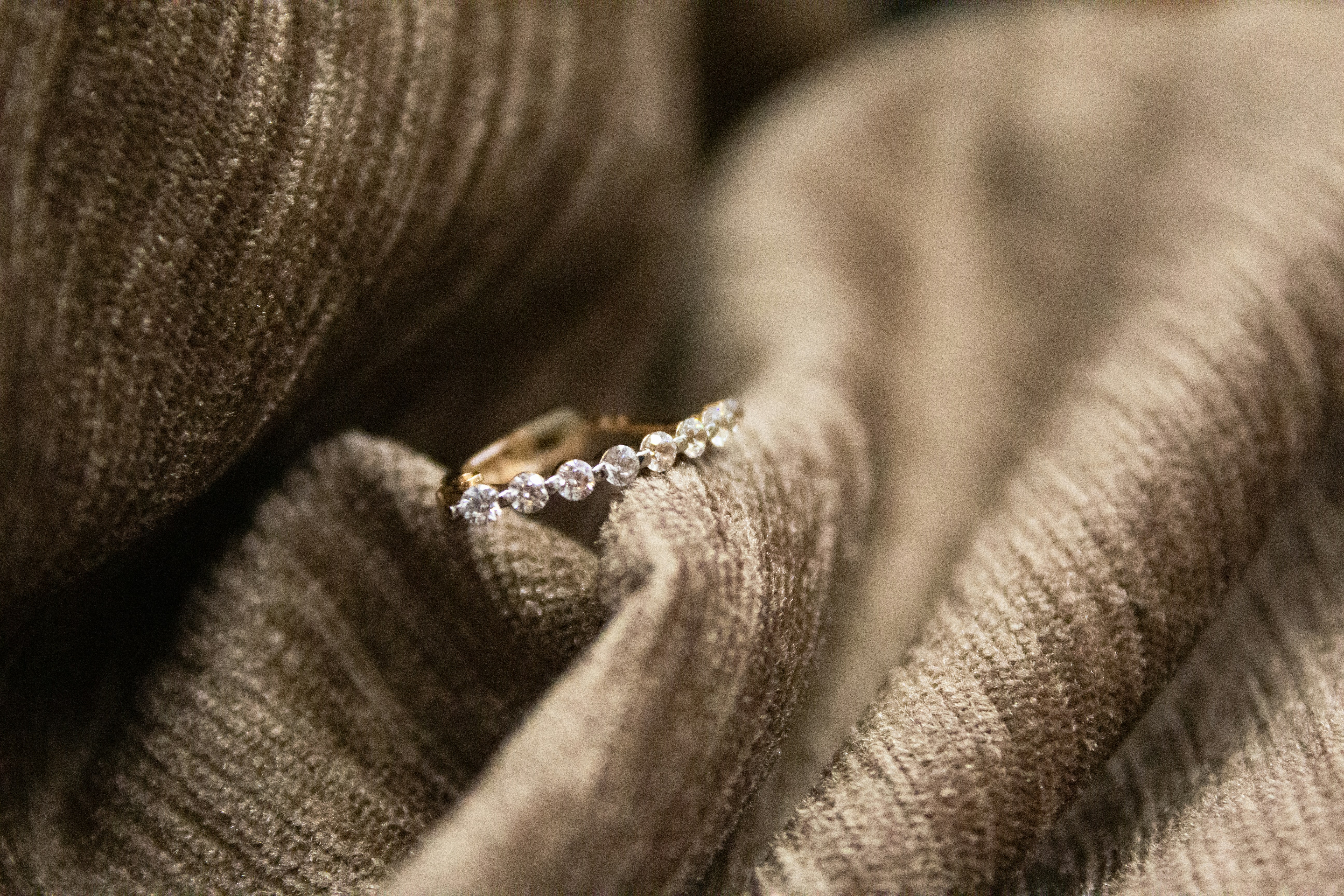 A close up of a ring on a fabric photo – Free Woman Image on Unsplash