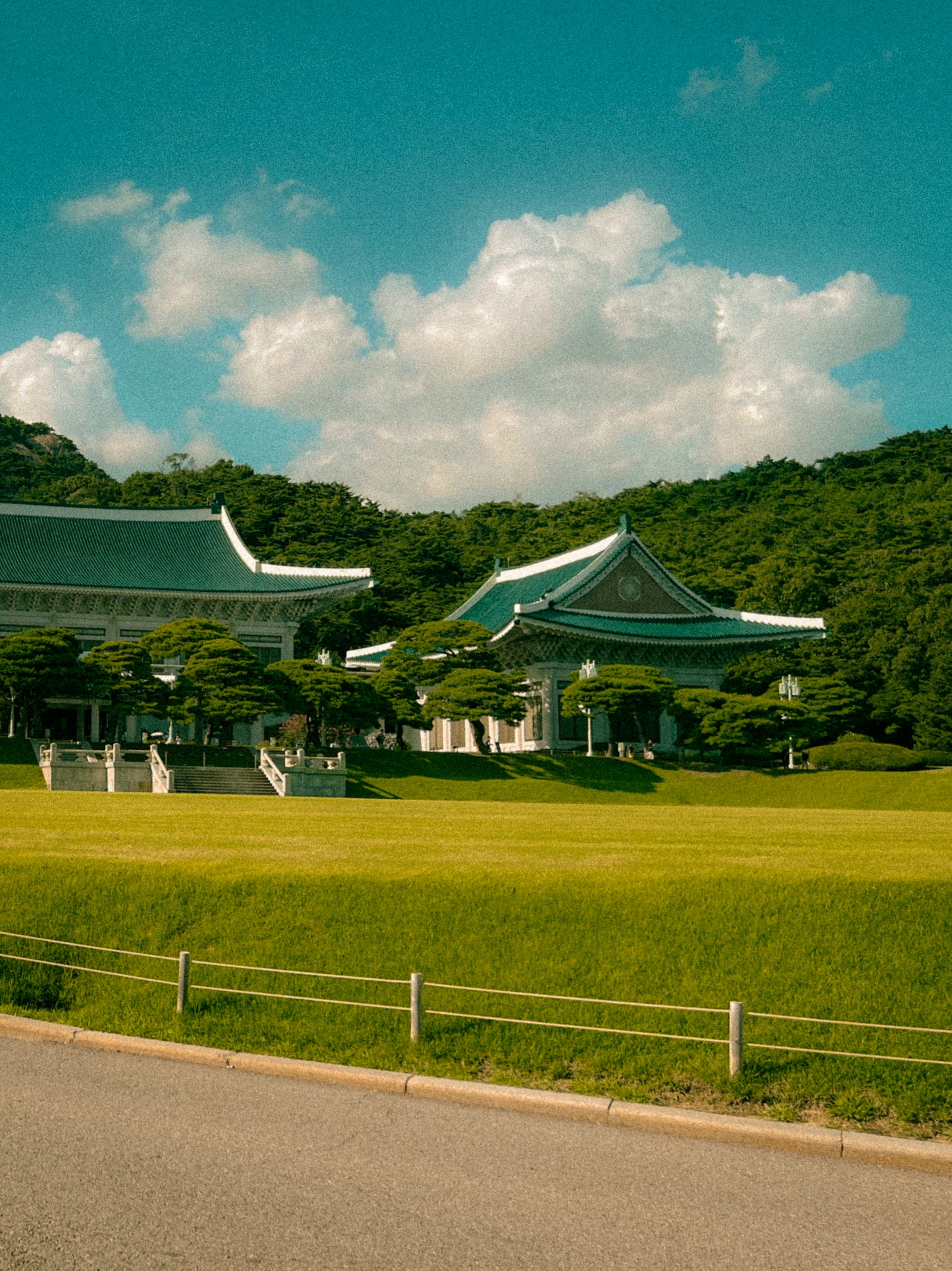 Teal Rooftops and Quiet Grounds: A Serene Temple Scene