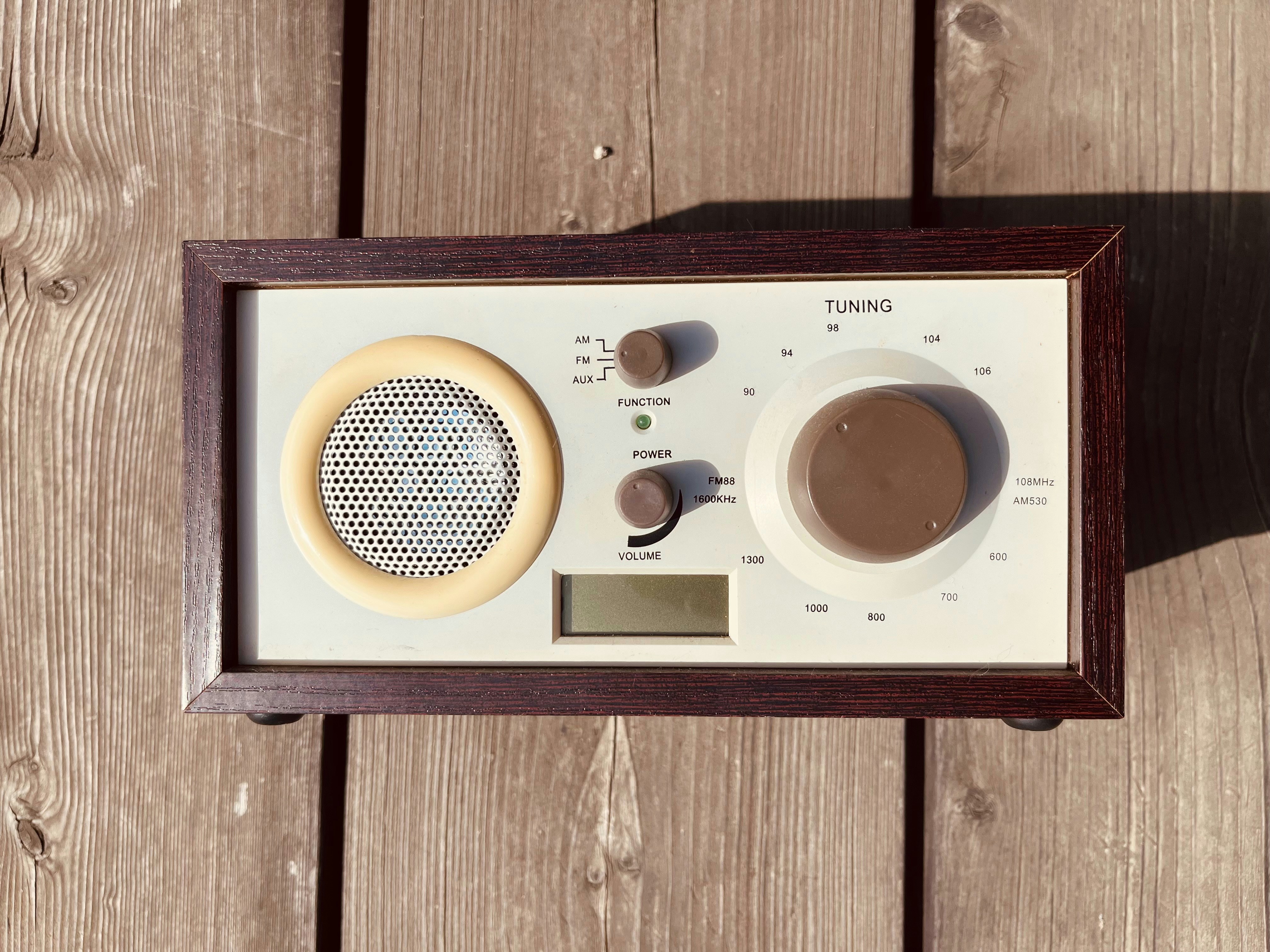 Sunlit Vintage Radio on Weathered Planks