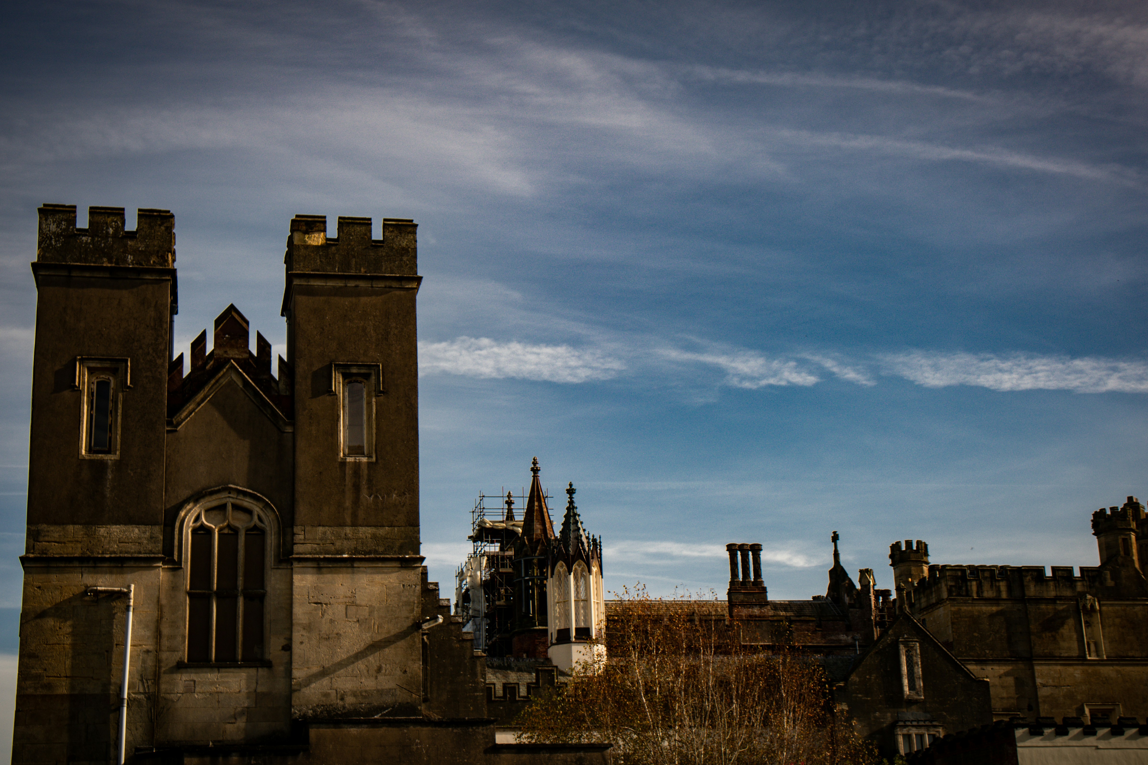 An old building with a clock on the front of it photo – Free Building Image on Unsplash