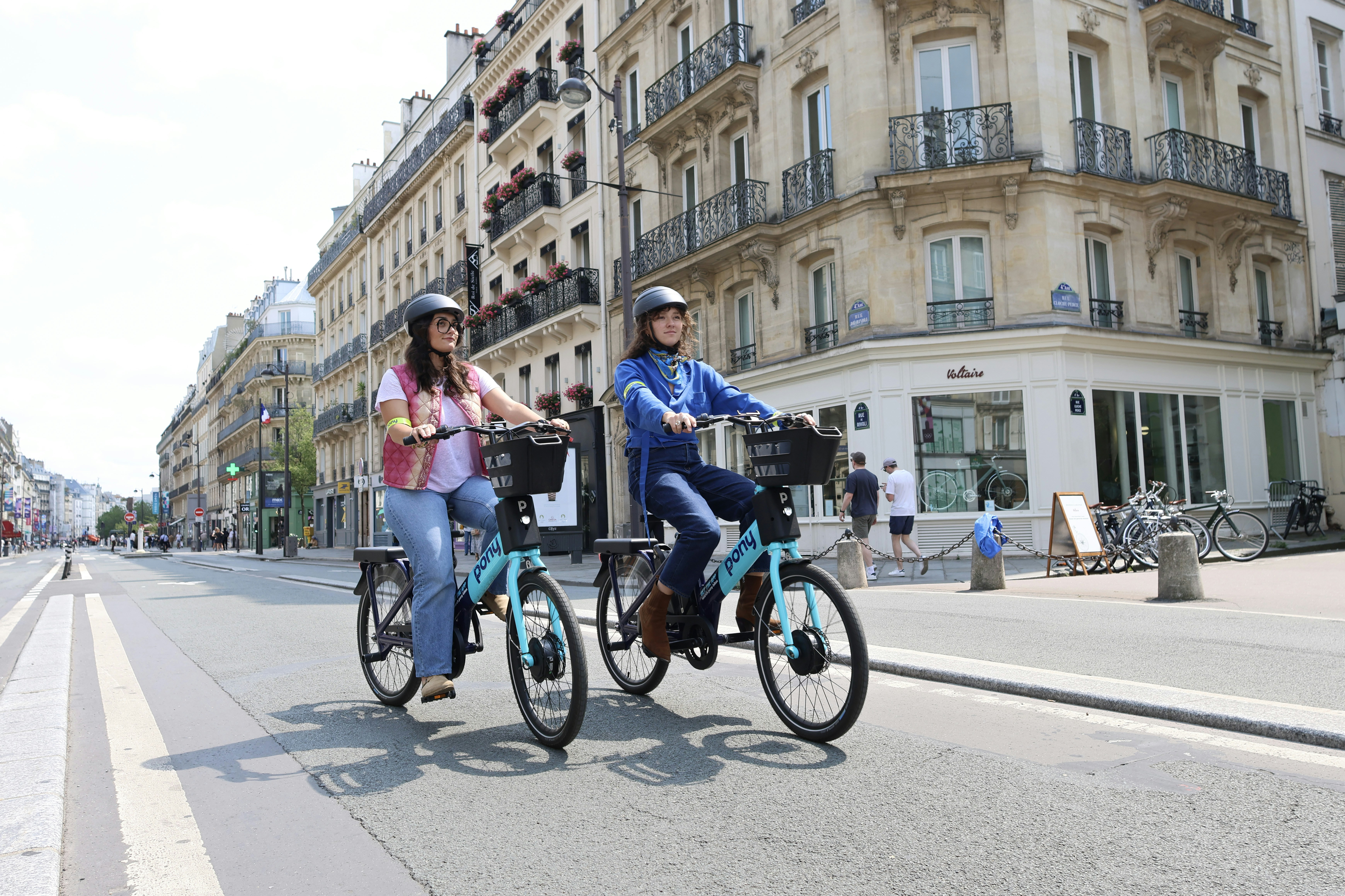 City Cyclists in Sync Along a Parisian Boulevard