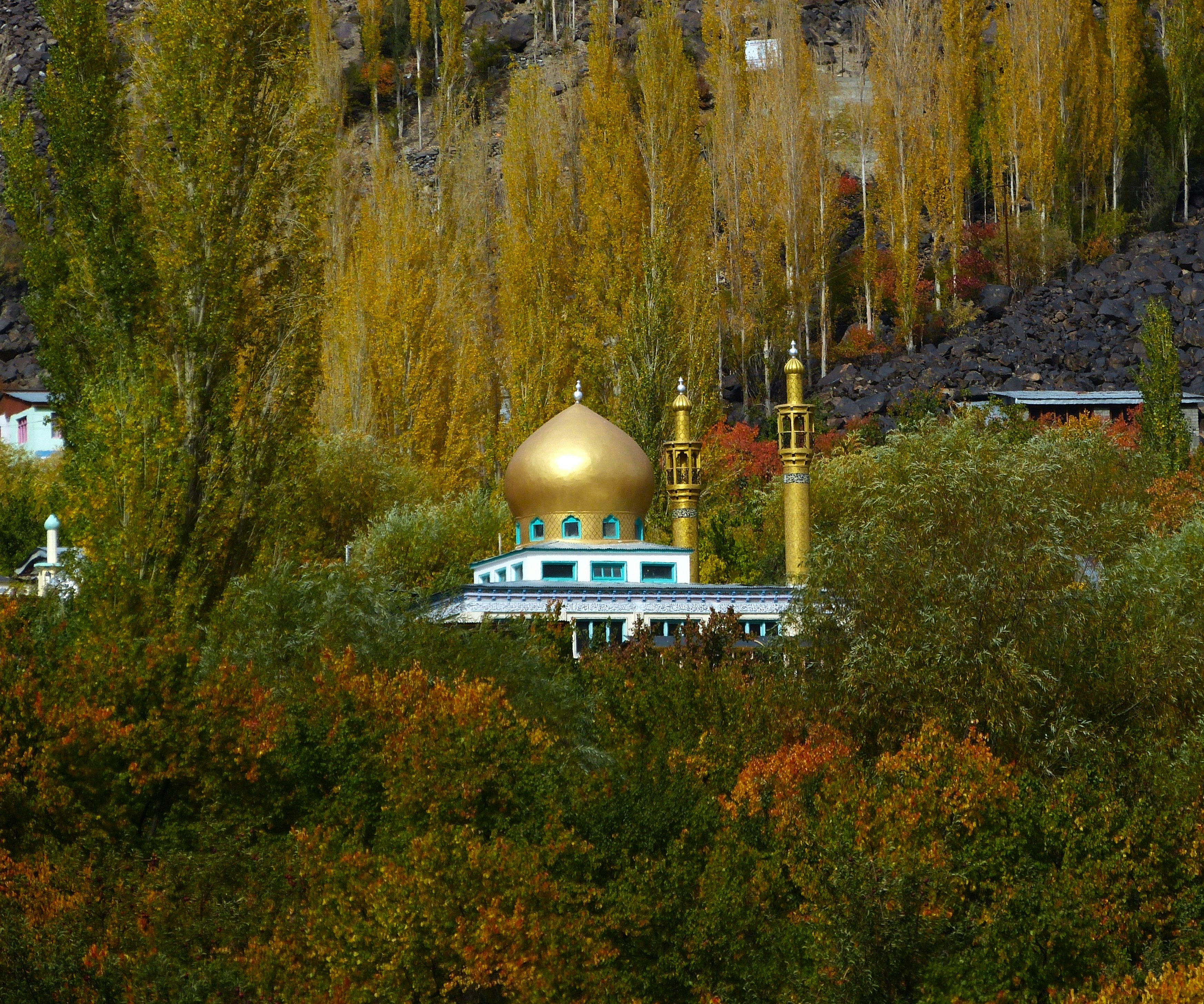 Gold Dome Amid Autumn Pines: A Hilltop Shrine Emerges