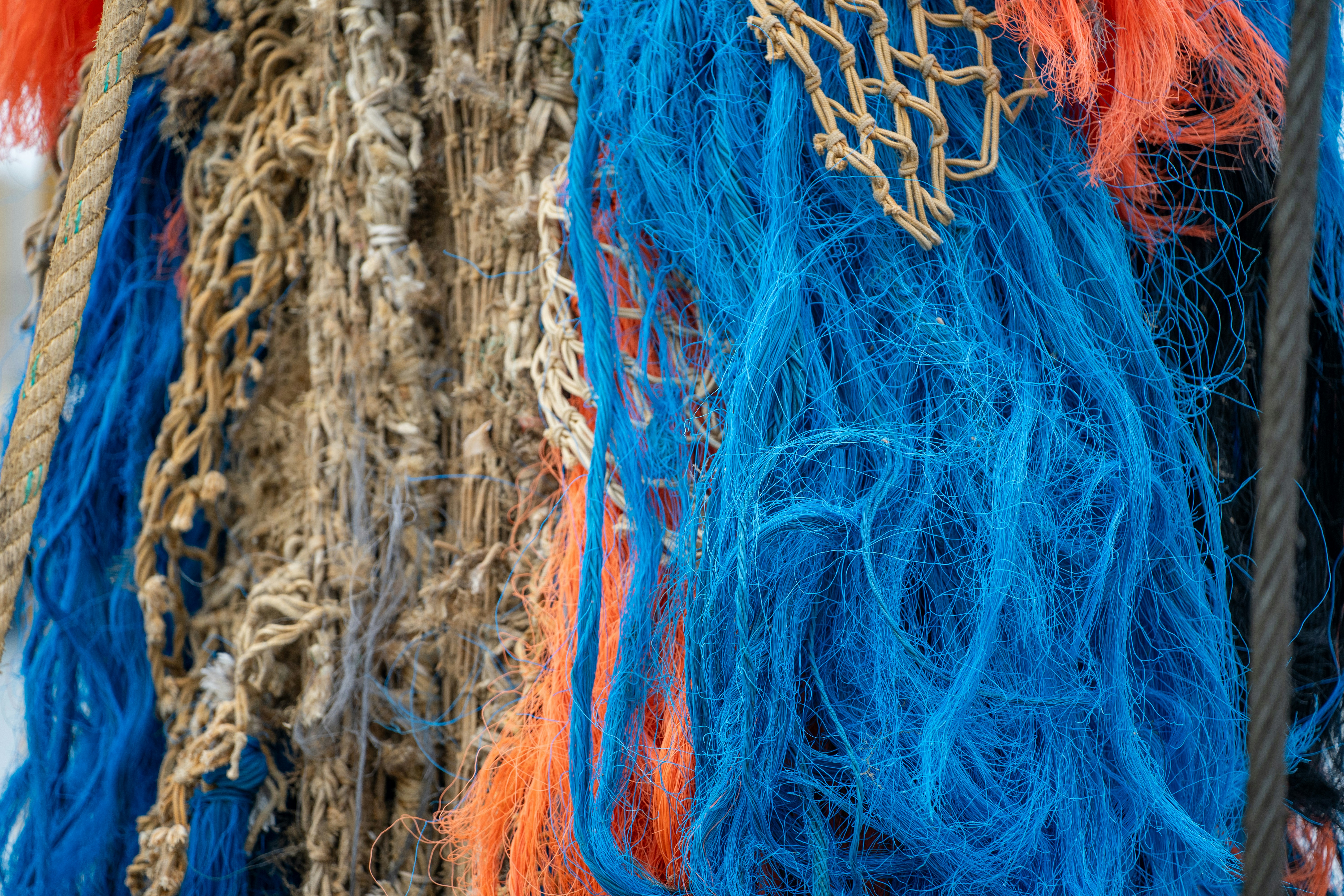 Fibers in Motion: A Tangle of Blue and Tan Threads