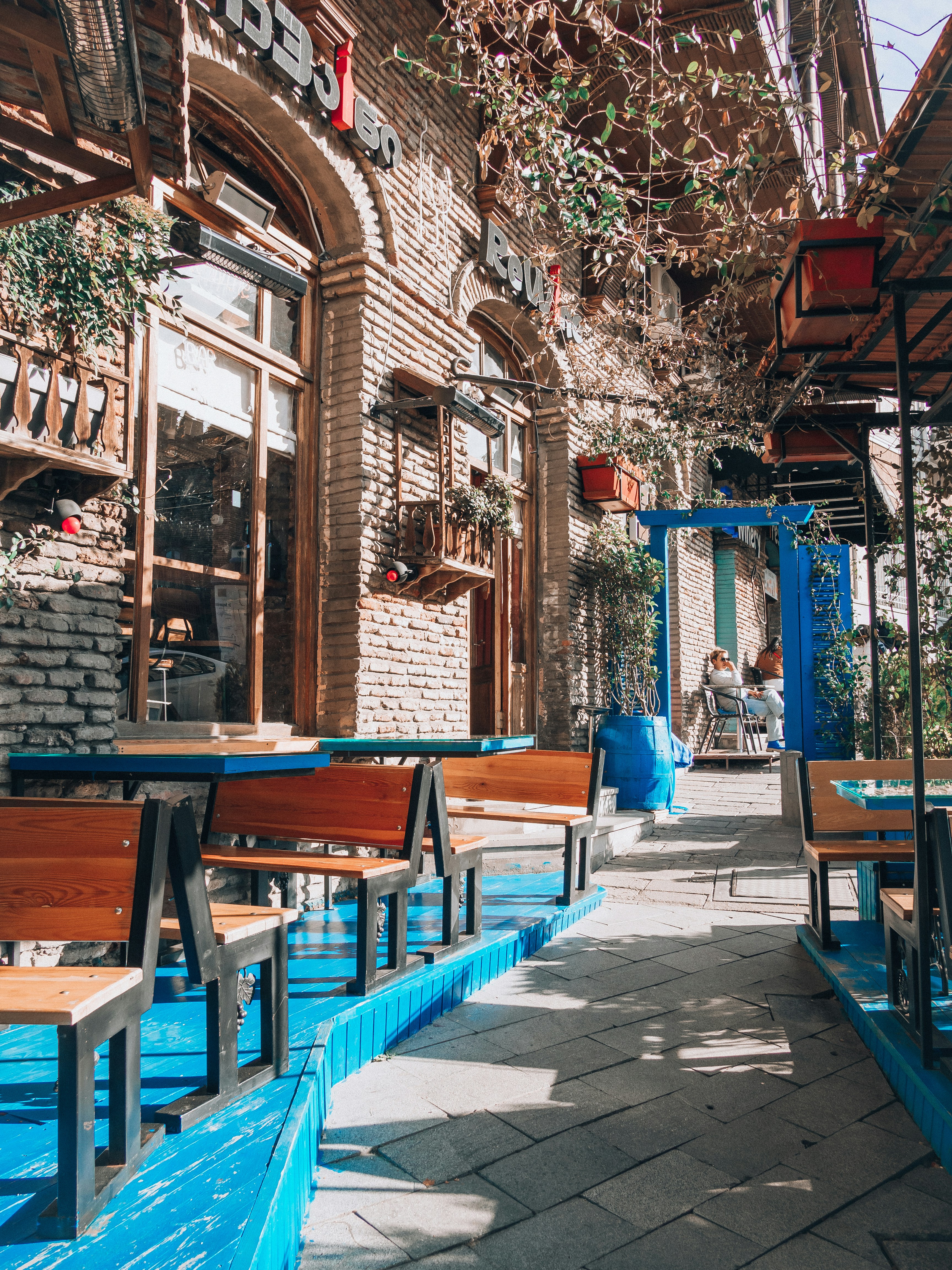 A row of wooden benches sitting next to a building