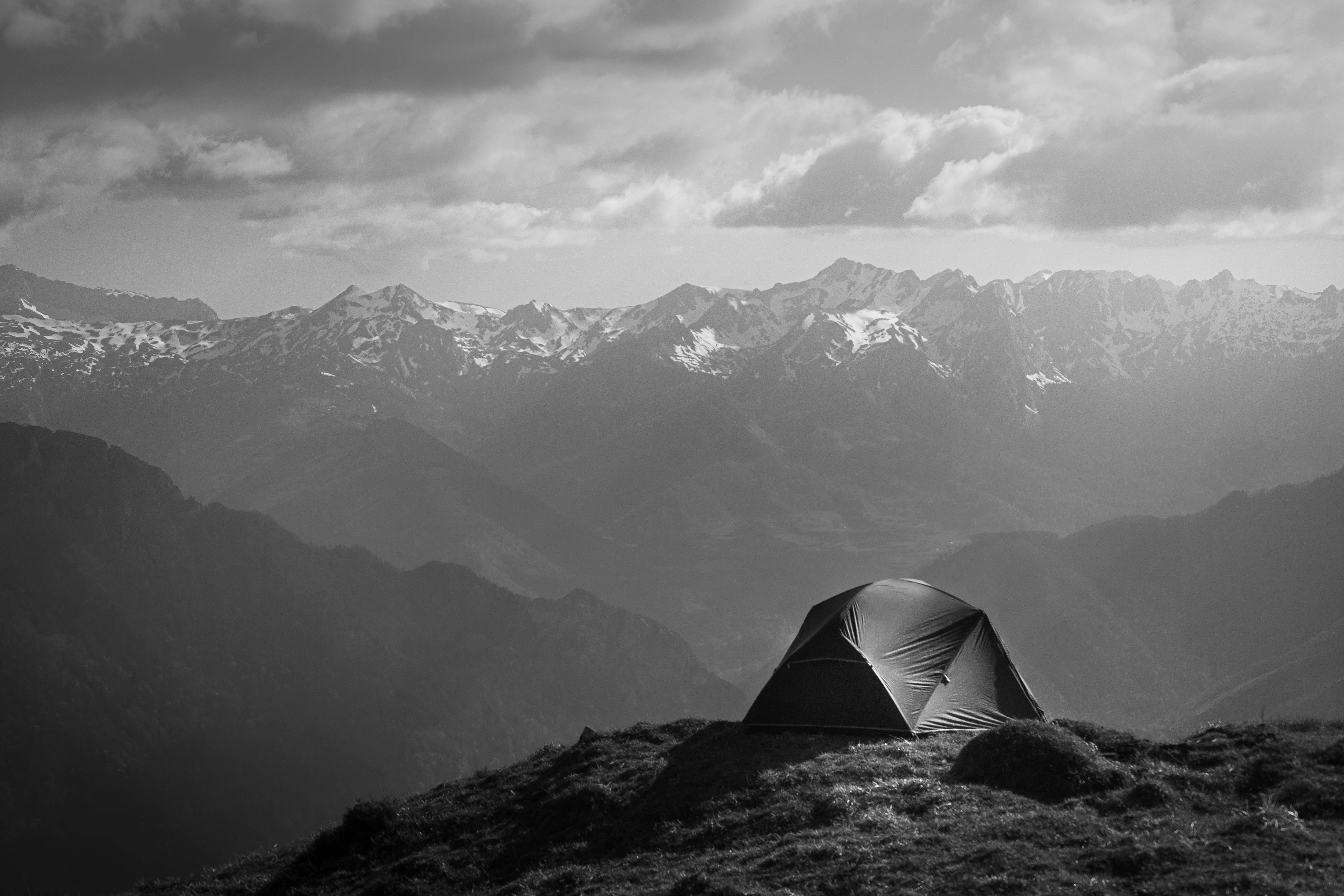 High-Altitude Shelter Under Snow-Dusted Peaks