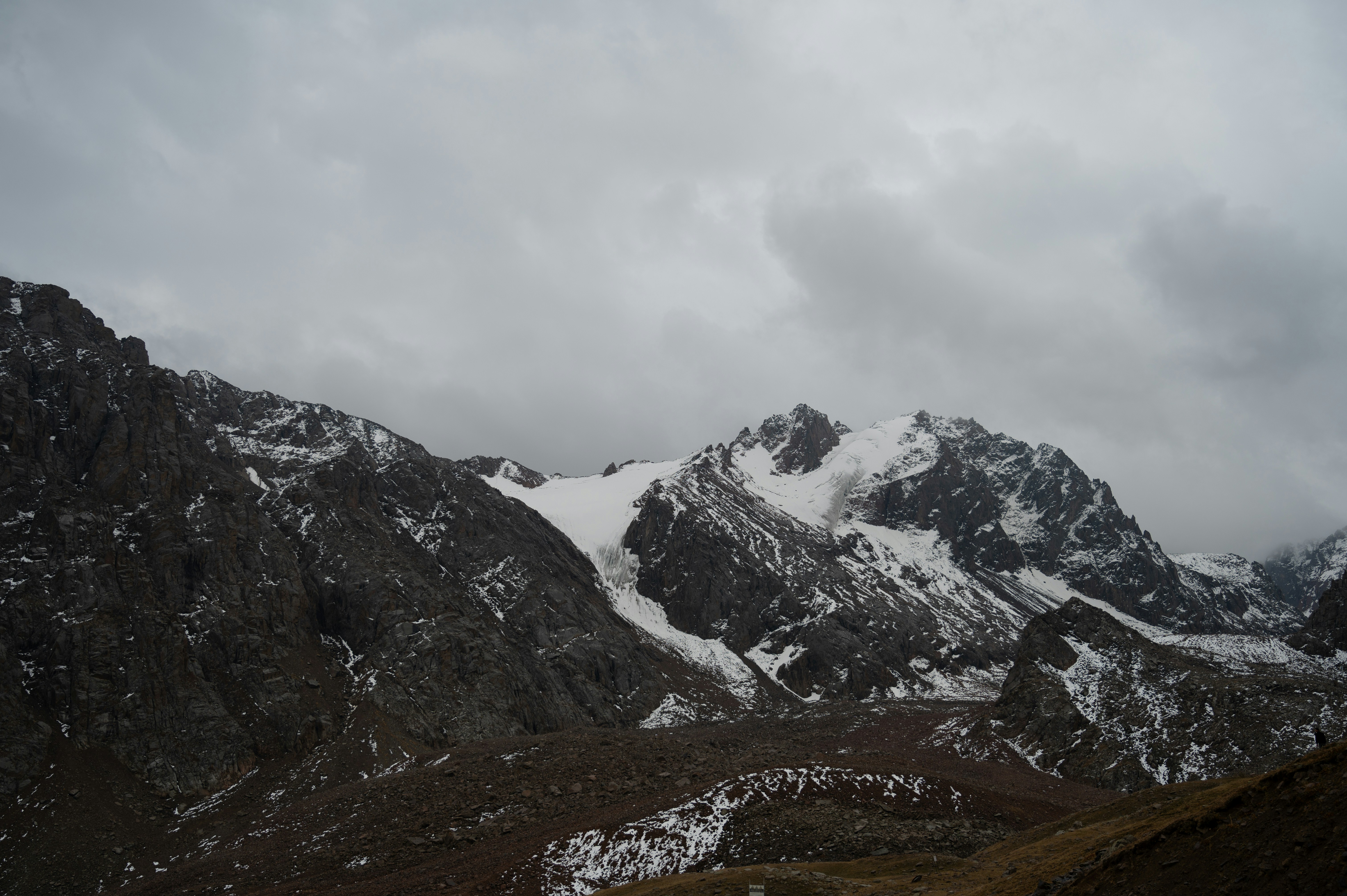 A snowy mountain on a cloudy day