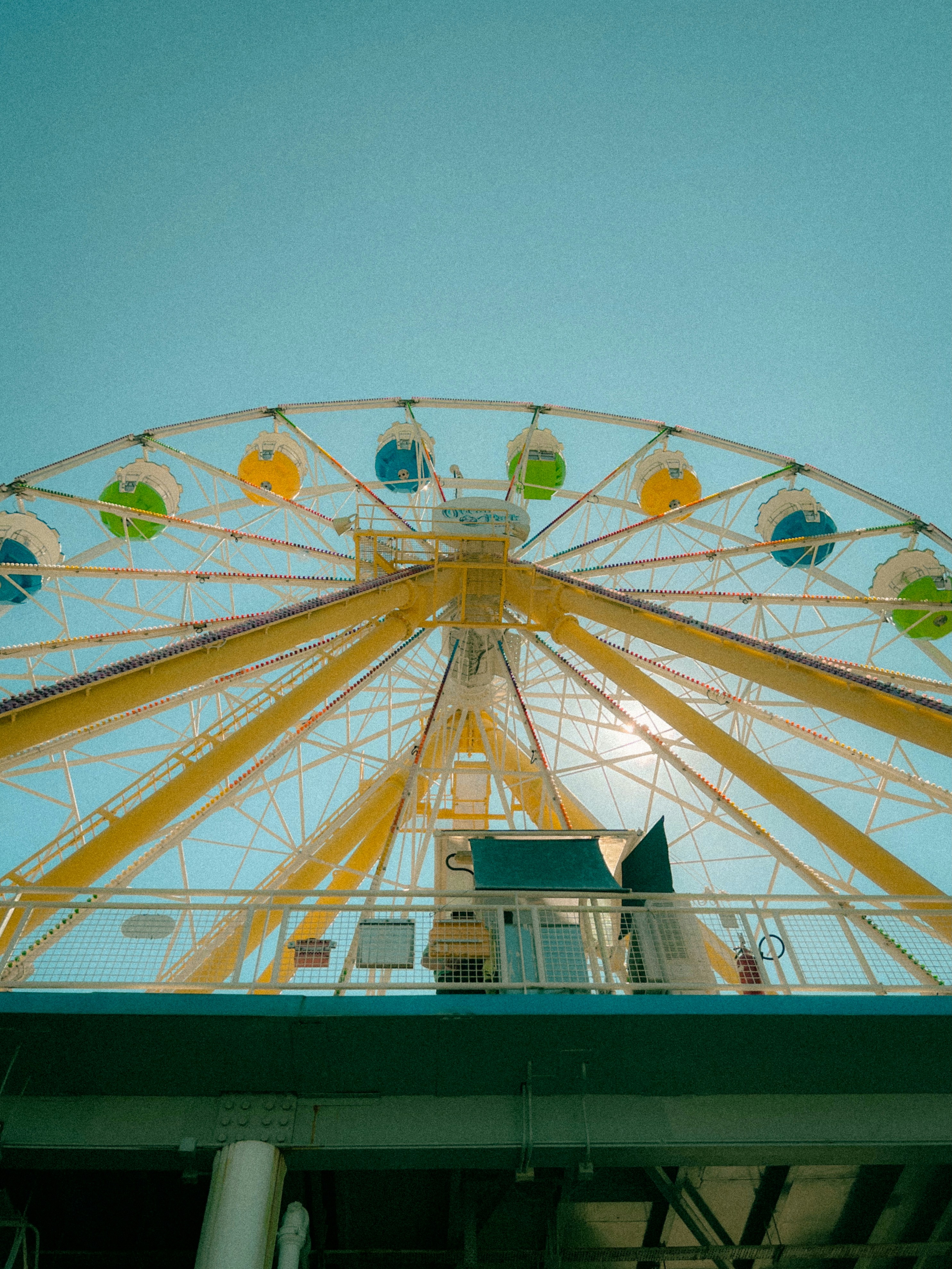A ferris wheel with a blue sky in the background photo – Free China ...