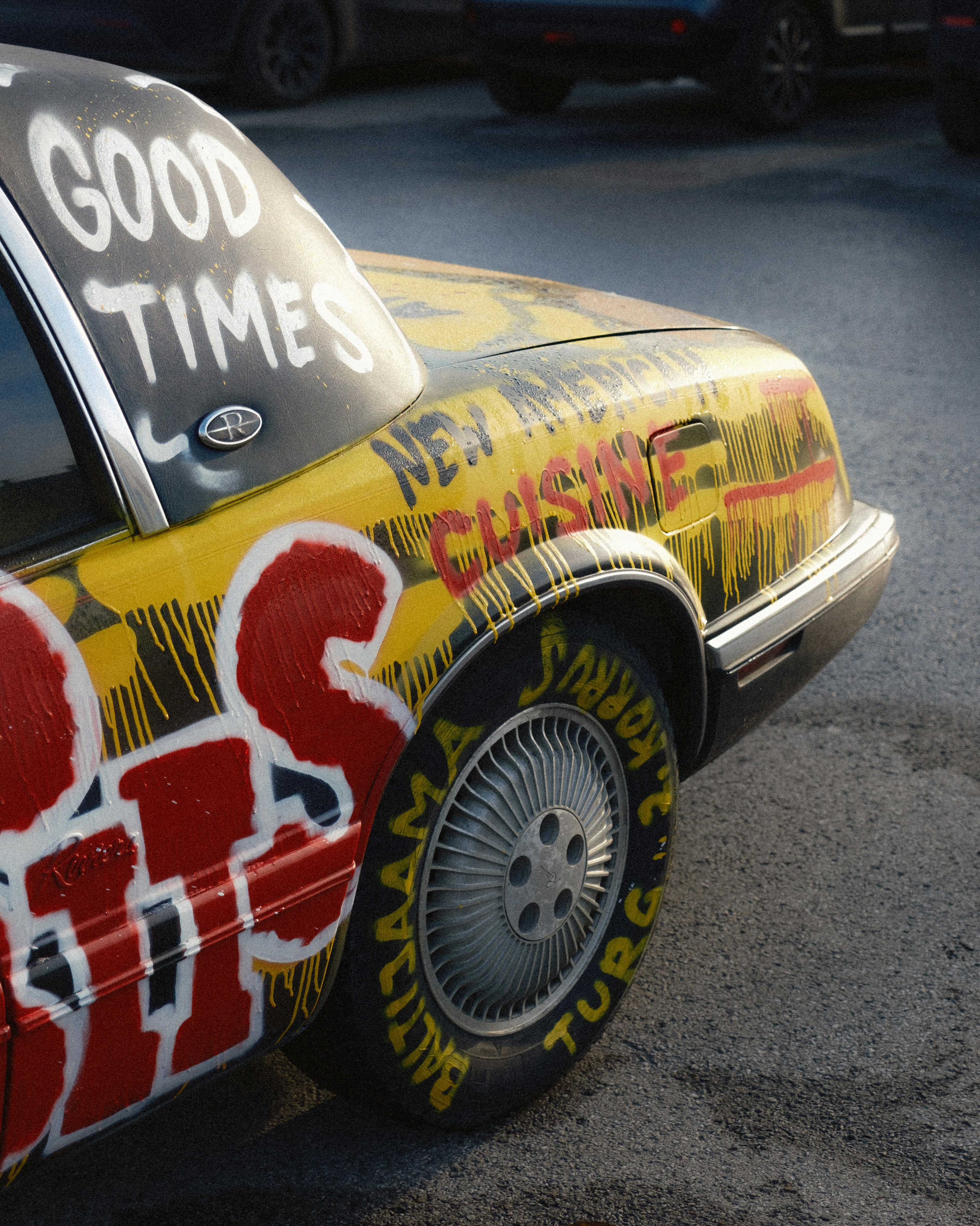 Painted Road Warrior: A Yellow Soma of Graffiti on a Taxi