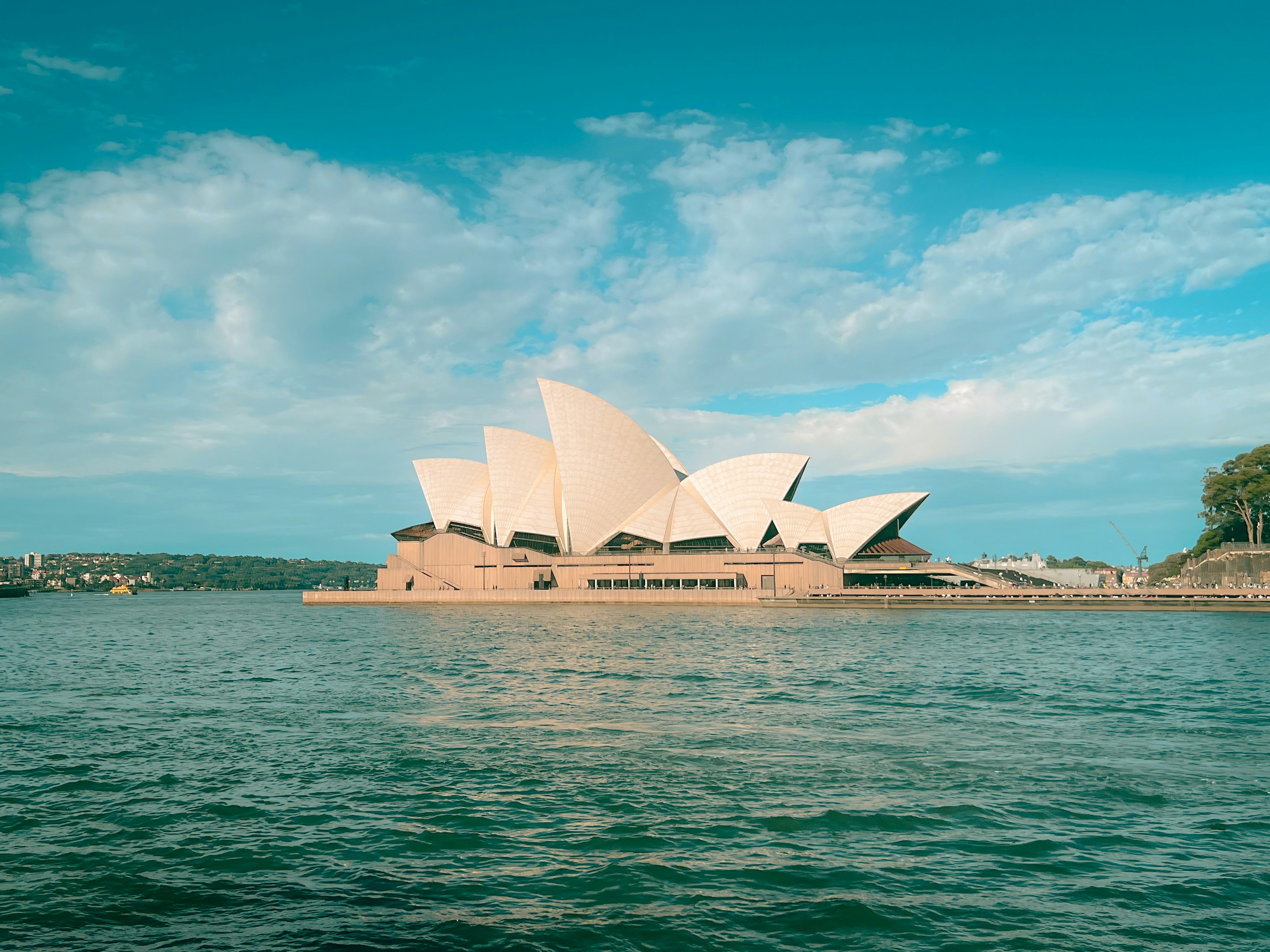 A view of the sydney opera house from across the water photo – Free ...