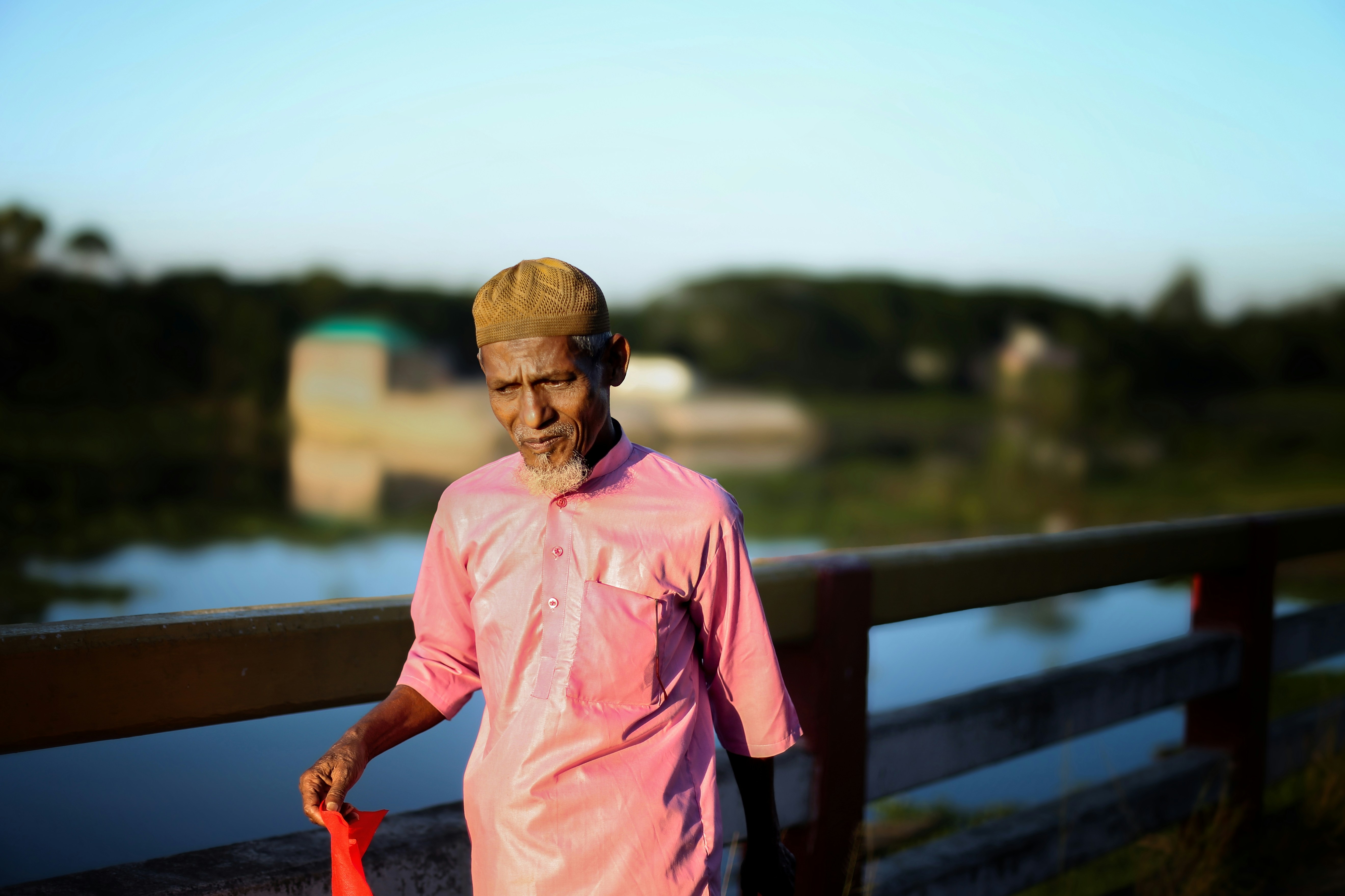 Coral Pink Riverside Moment: A Quiet Portrait by the Water