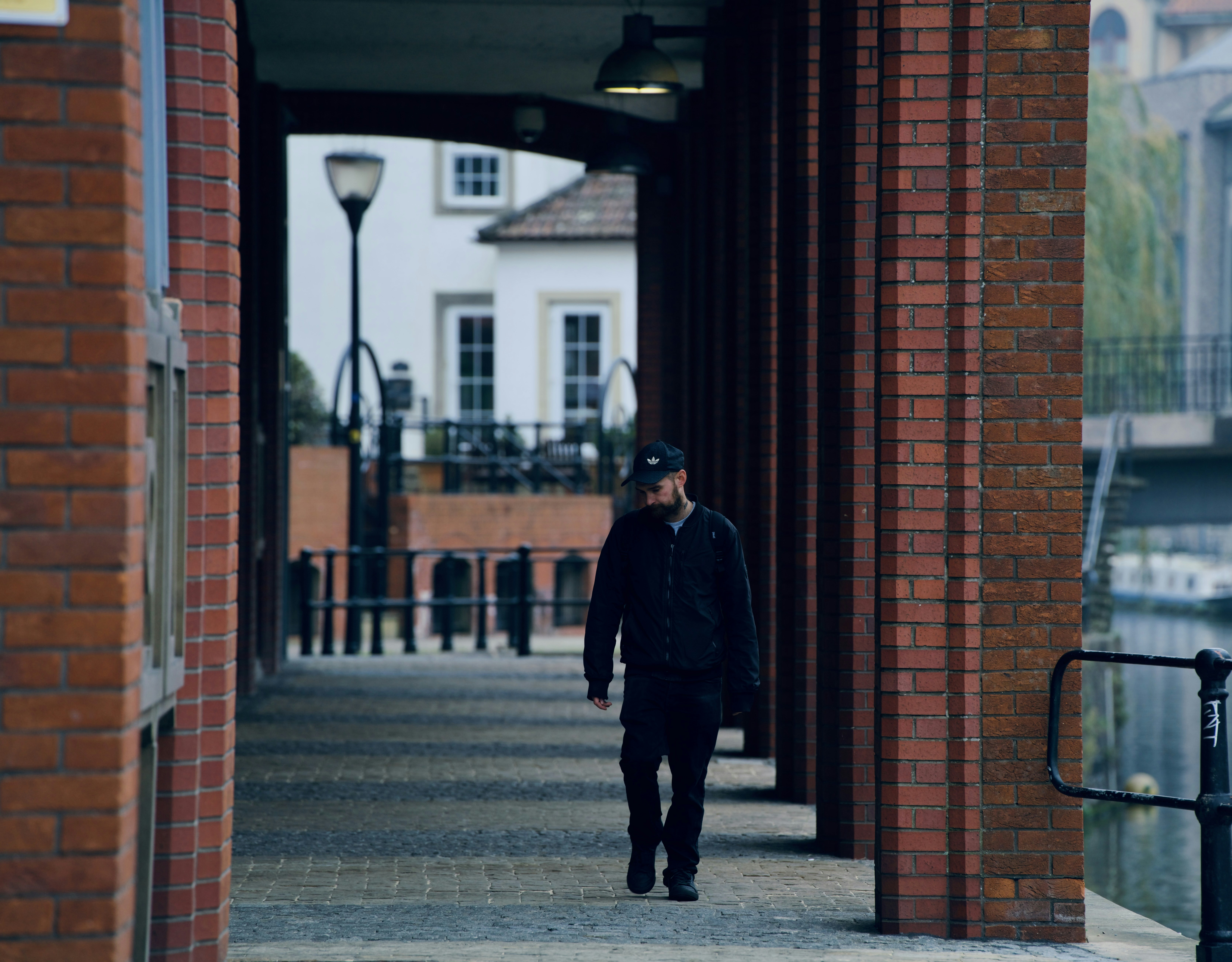 Under Brick Arches: A Quiet Walker Through a Waterfront Corridor