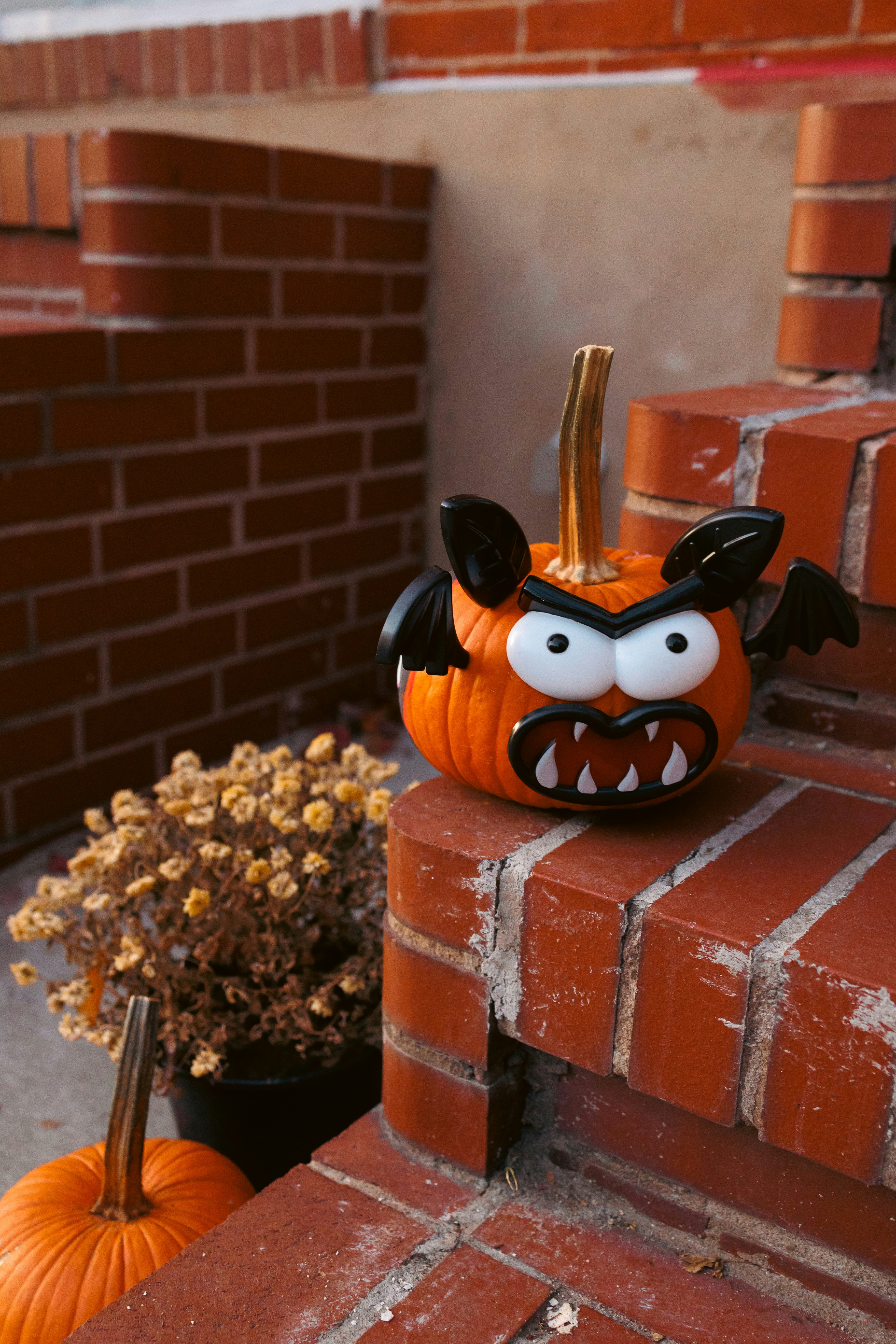 Guarding the Brick Stair: A Fierce Jack-O'-Lantern on Halloween Steps