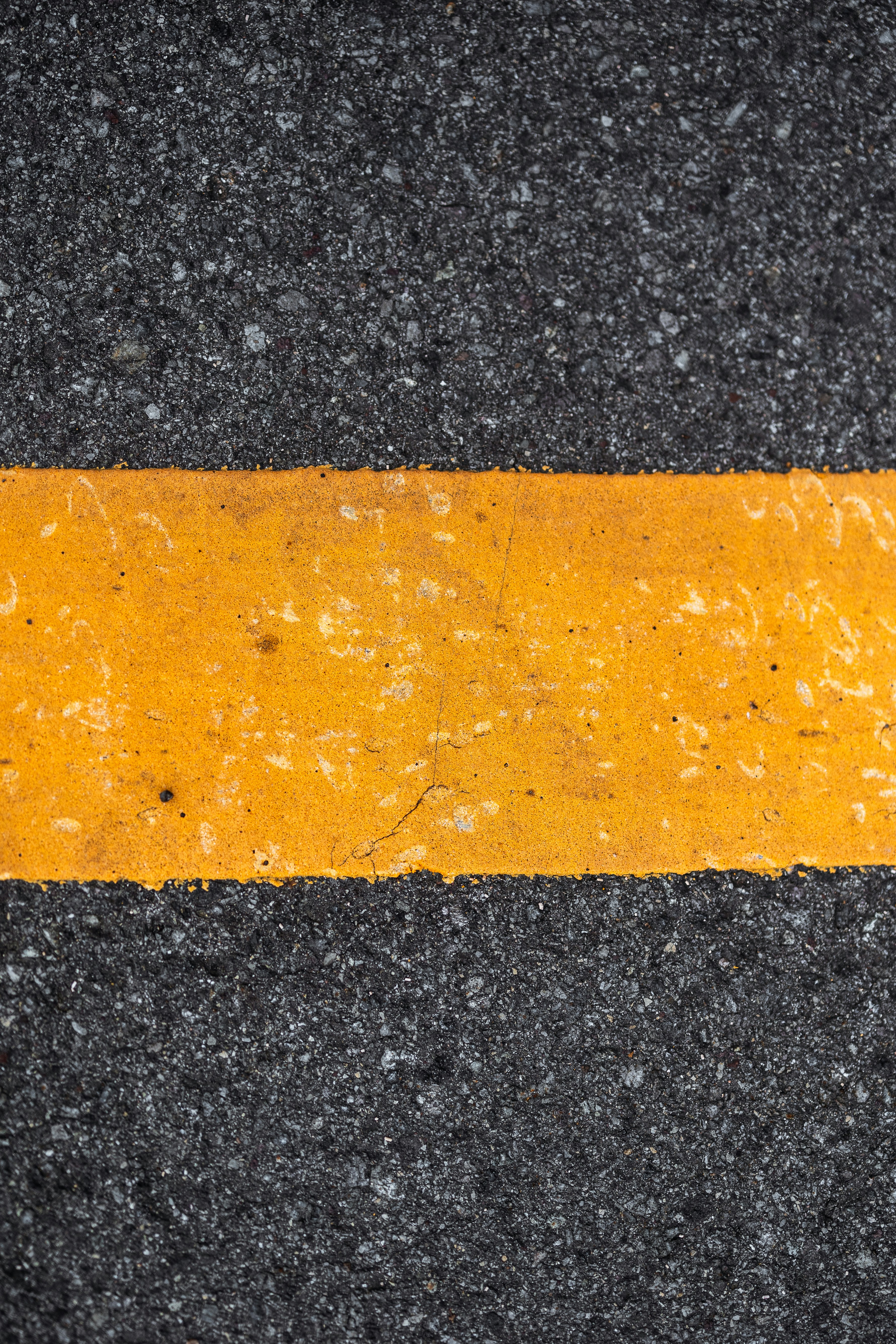A yellow line painted on the asphalt of a street photo – Free Nikko ...