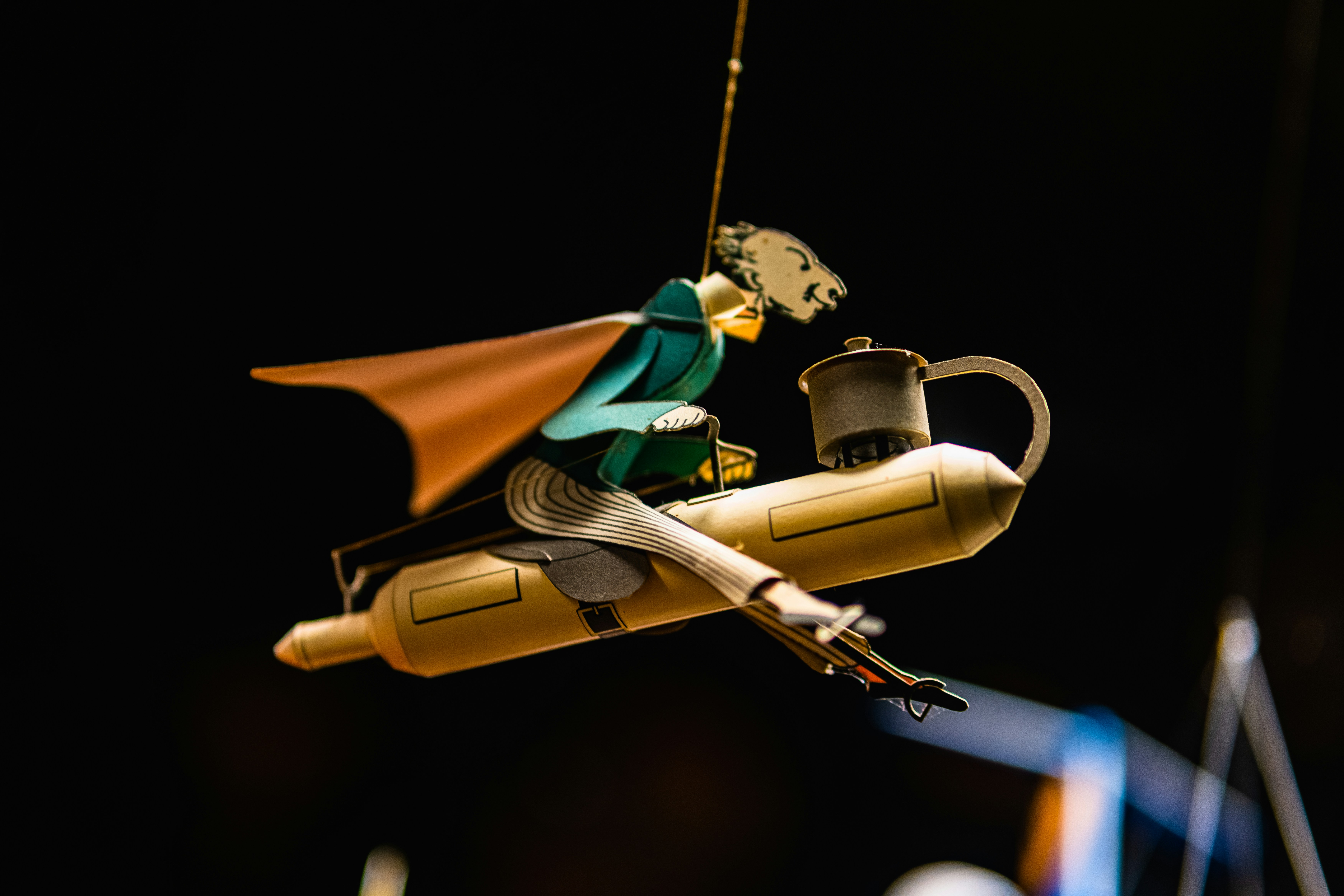 Teal-Caped LEGO Pilot Takes a Moonlit Flight on a Gleaming Gold Rocket