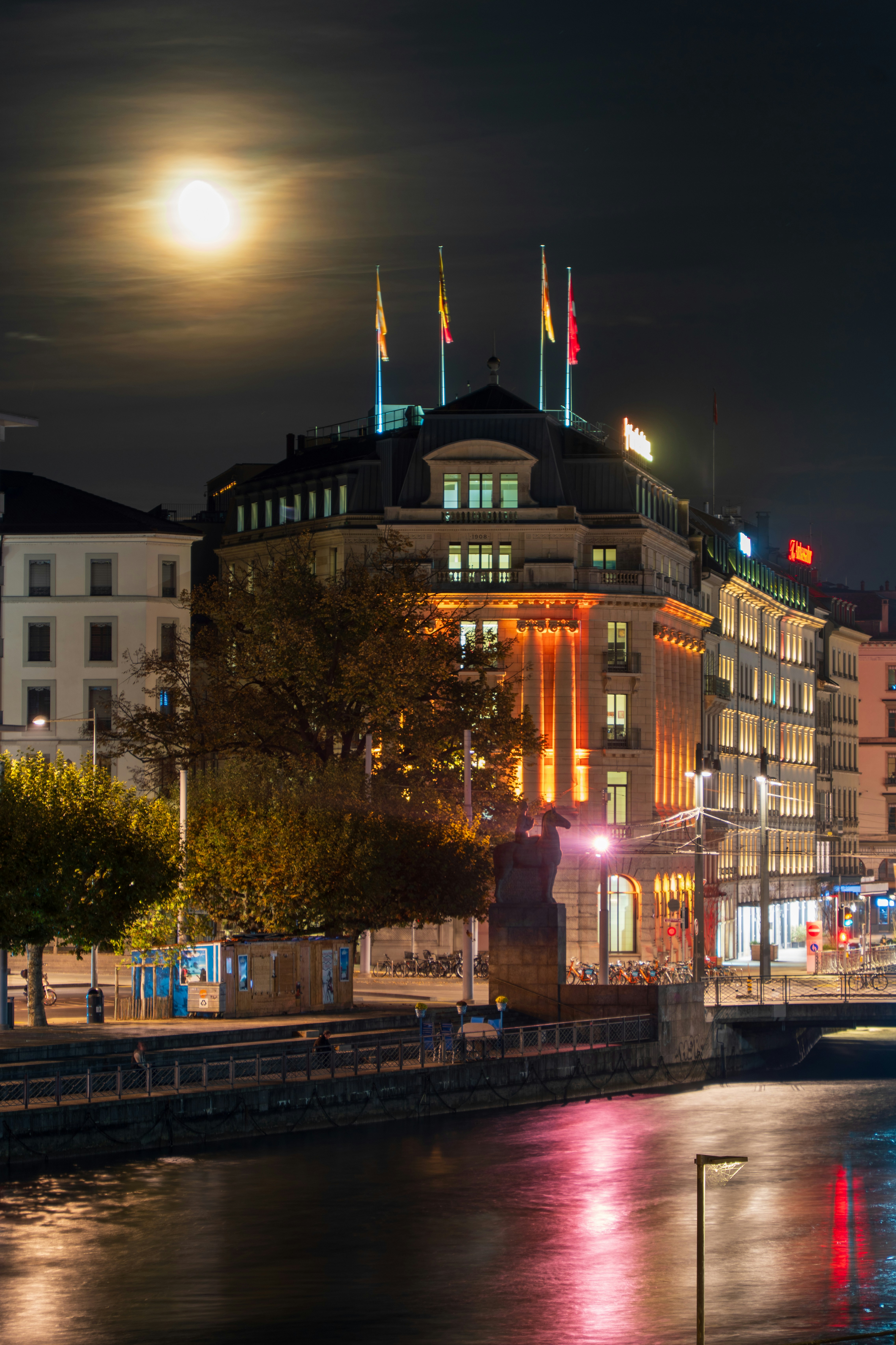 Moonlit Canalfront: Neon Glow and Historic Facades