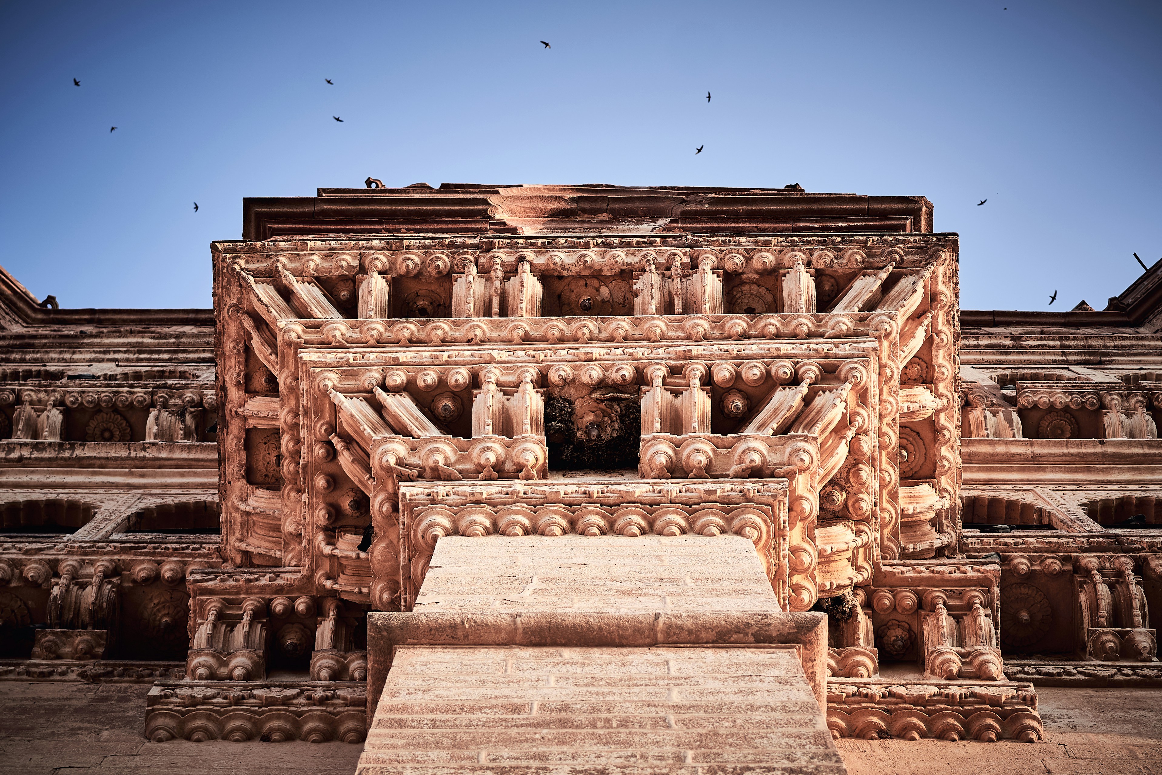 A very large building with a very tall column photo – Free Building ...