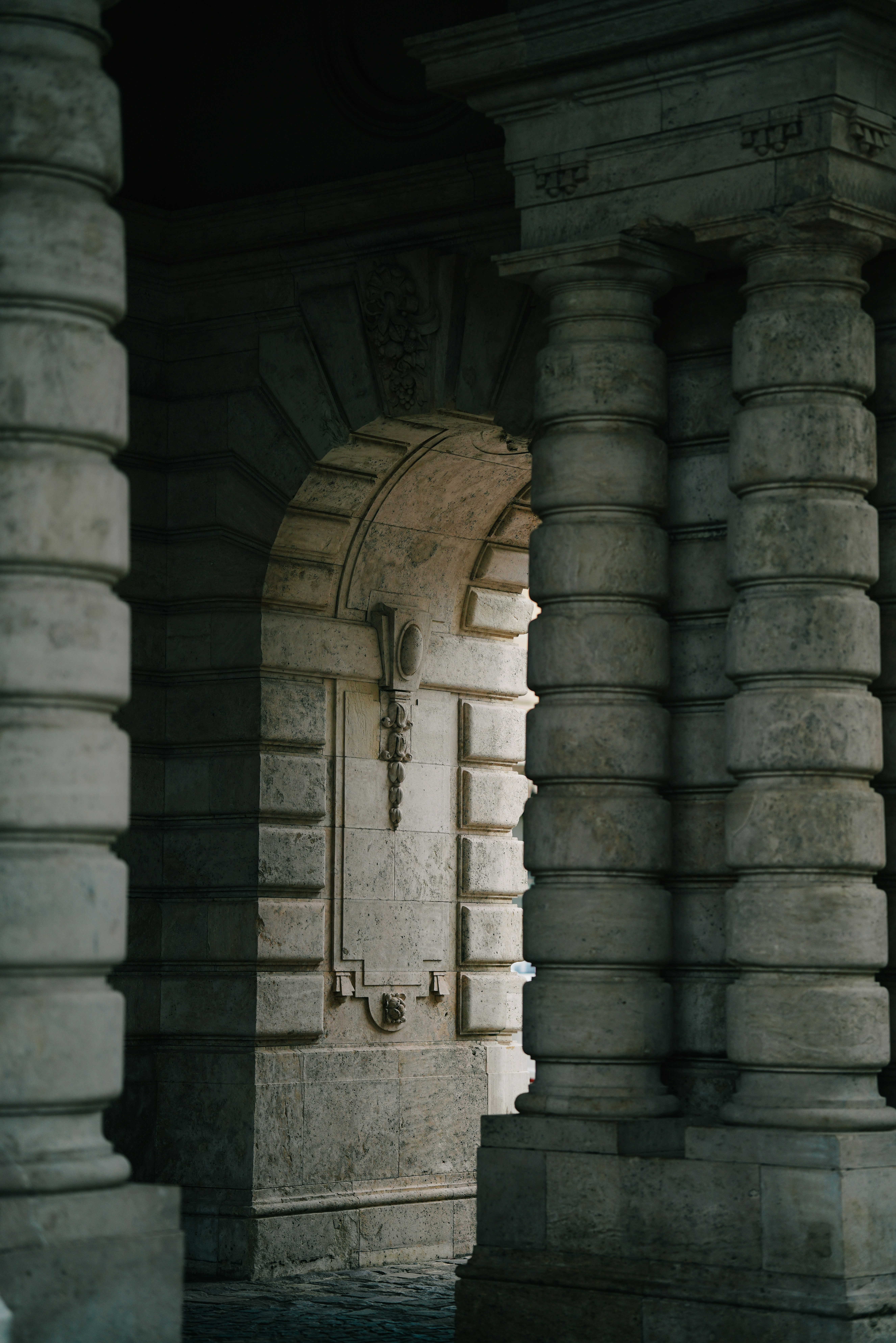 A stone archway with a clock on the side of it photo – Free Crypt Image ...
