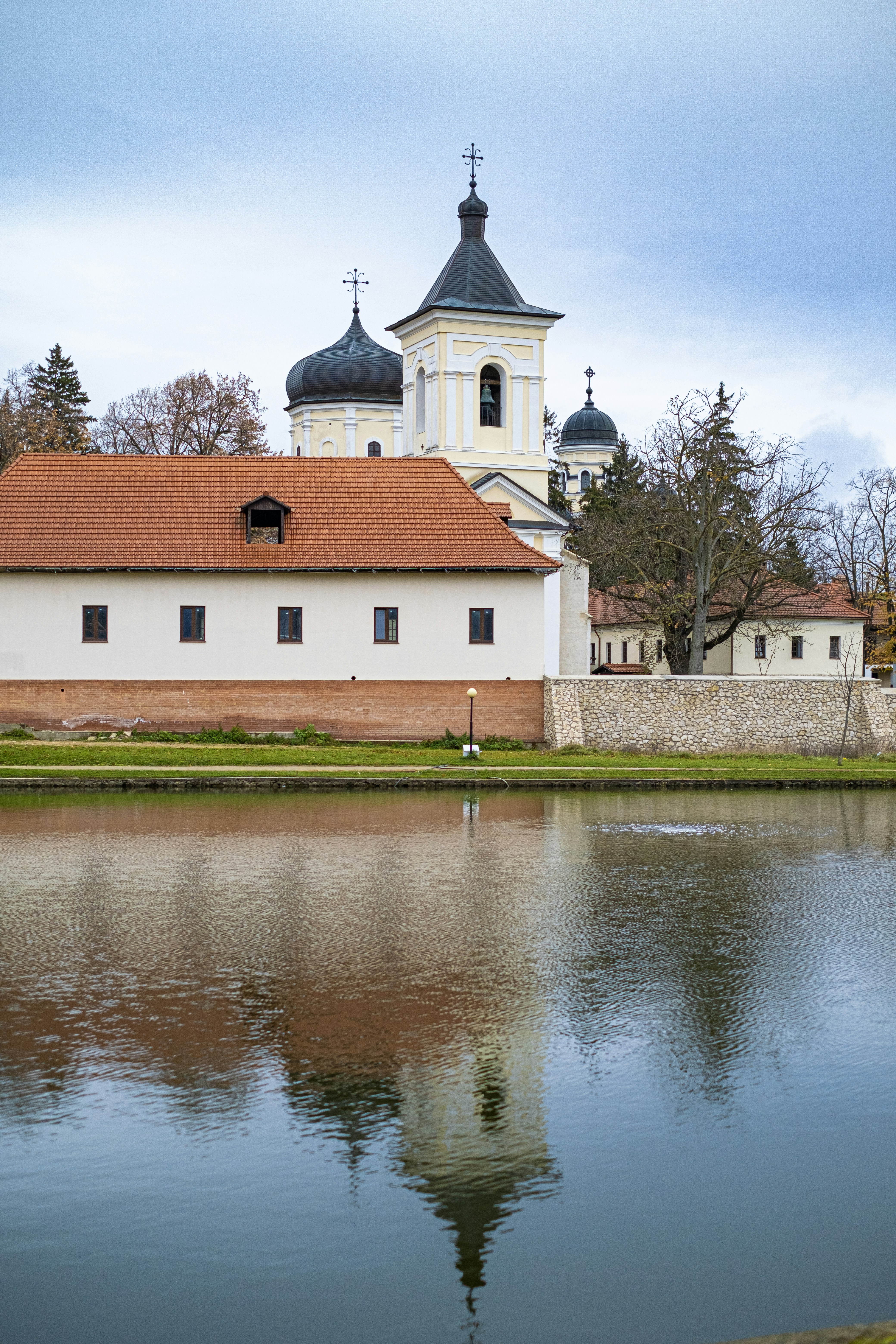 Riverside Monastery Silhouette and Broad Reflection