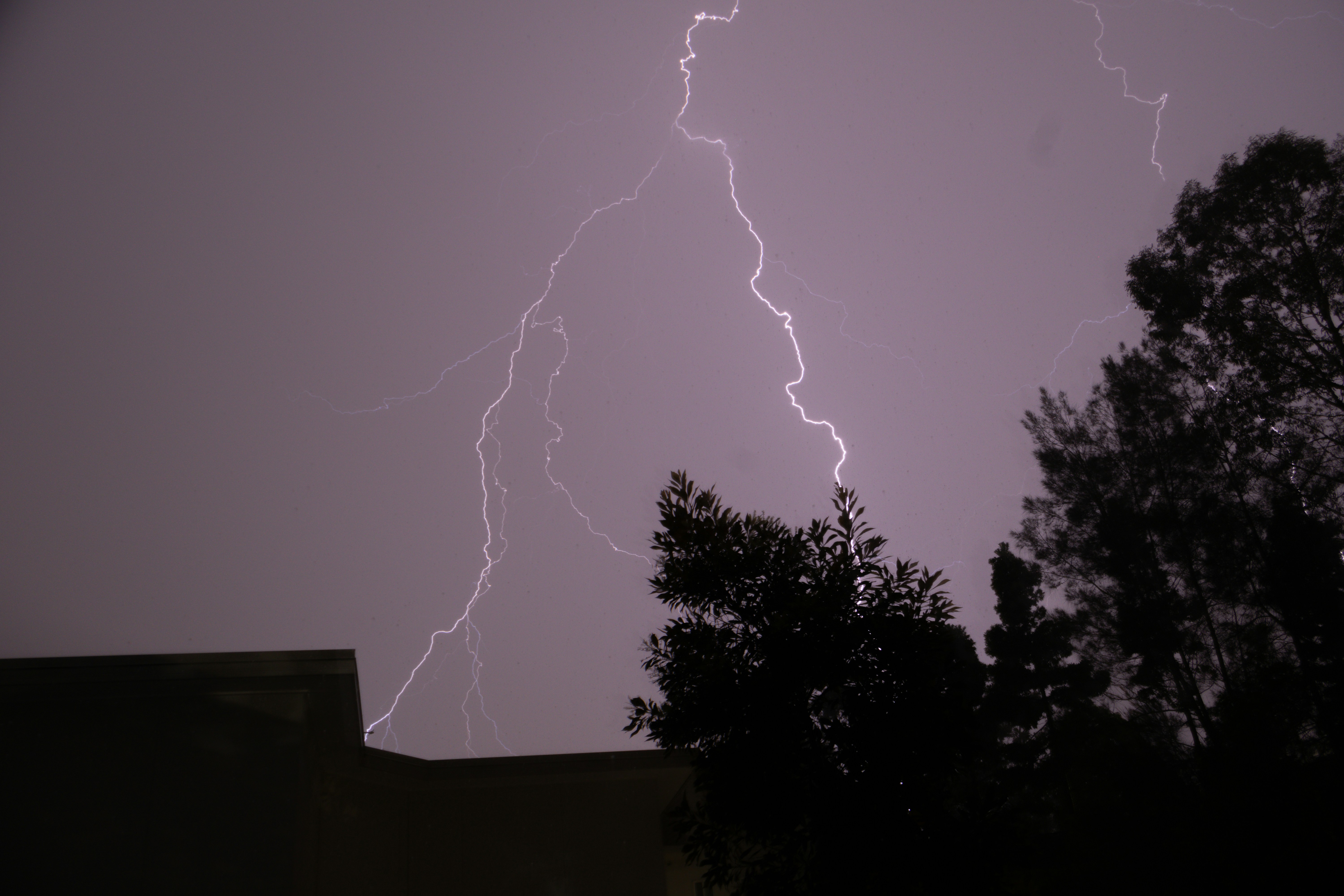 Electric Veil over a Quiet Suburban Skyline