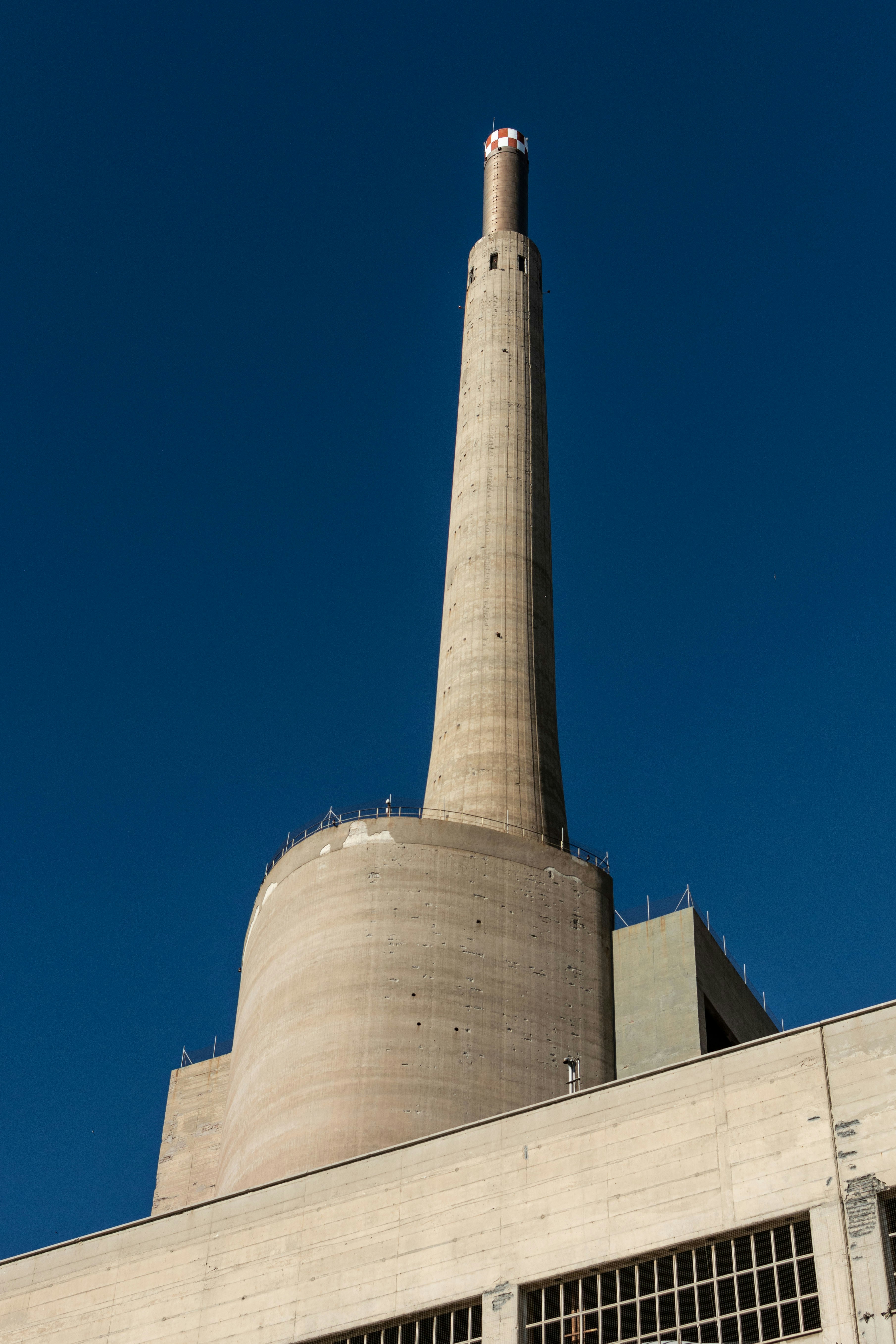 Concrete Spire Against a Pristine Blue Sky