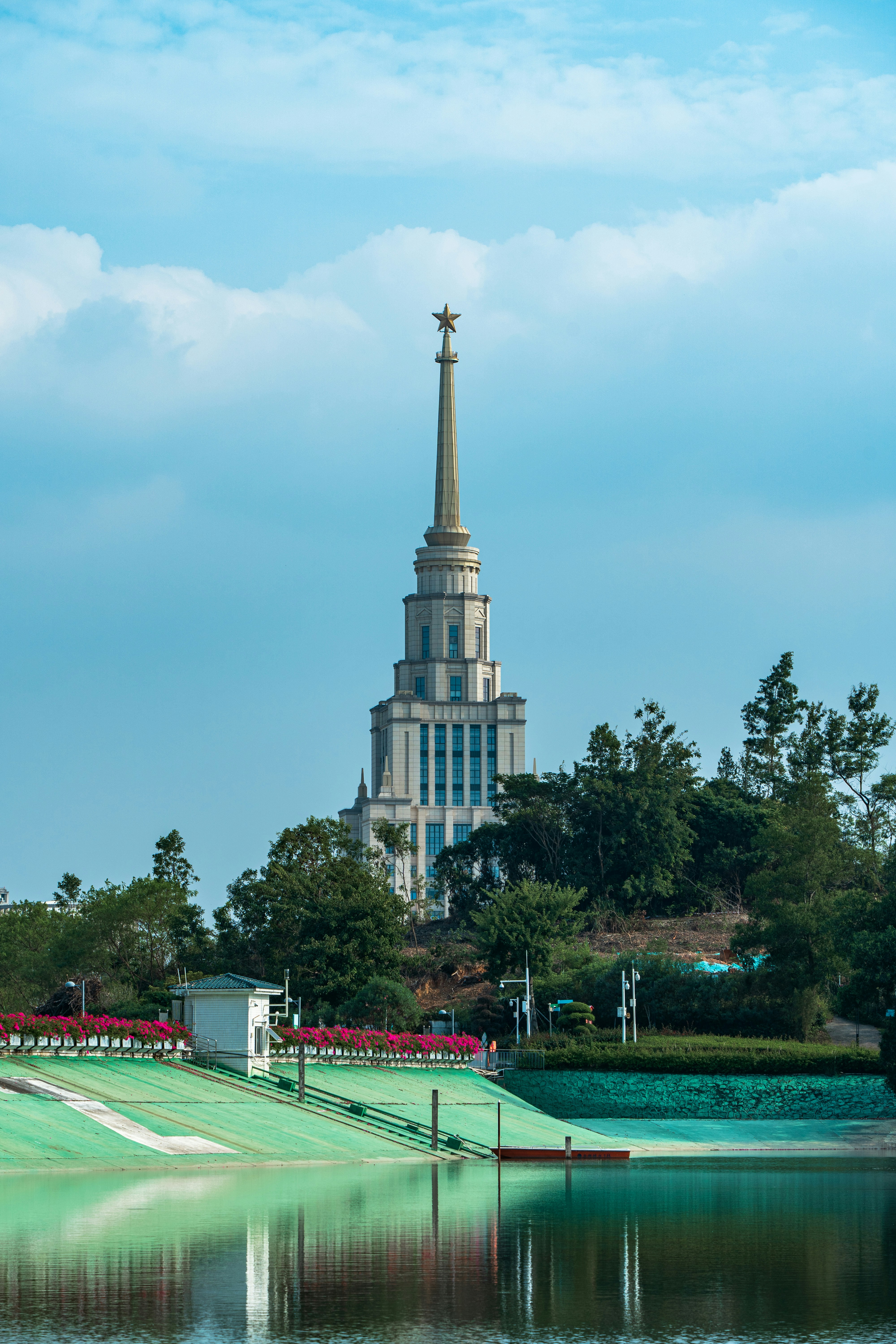 Star-Topped Spire Anchors a Quiet Riverside Panorama