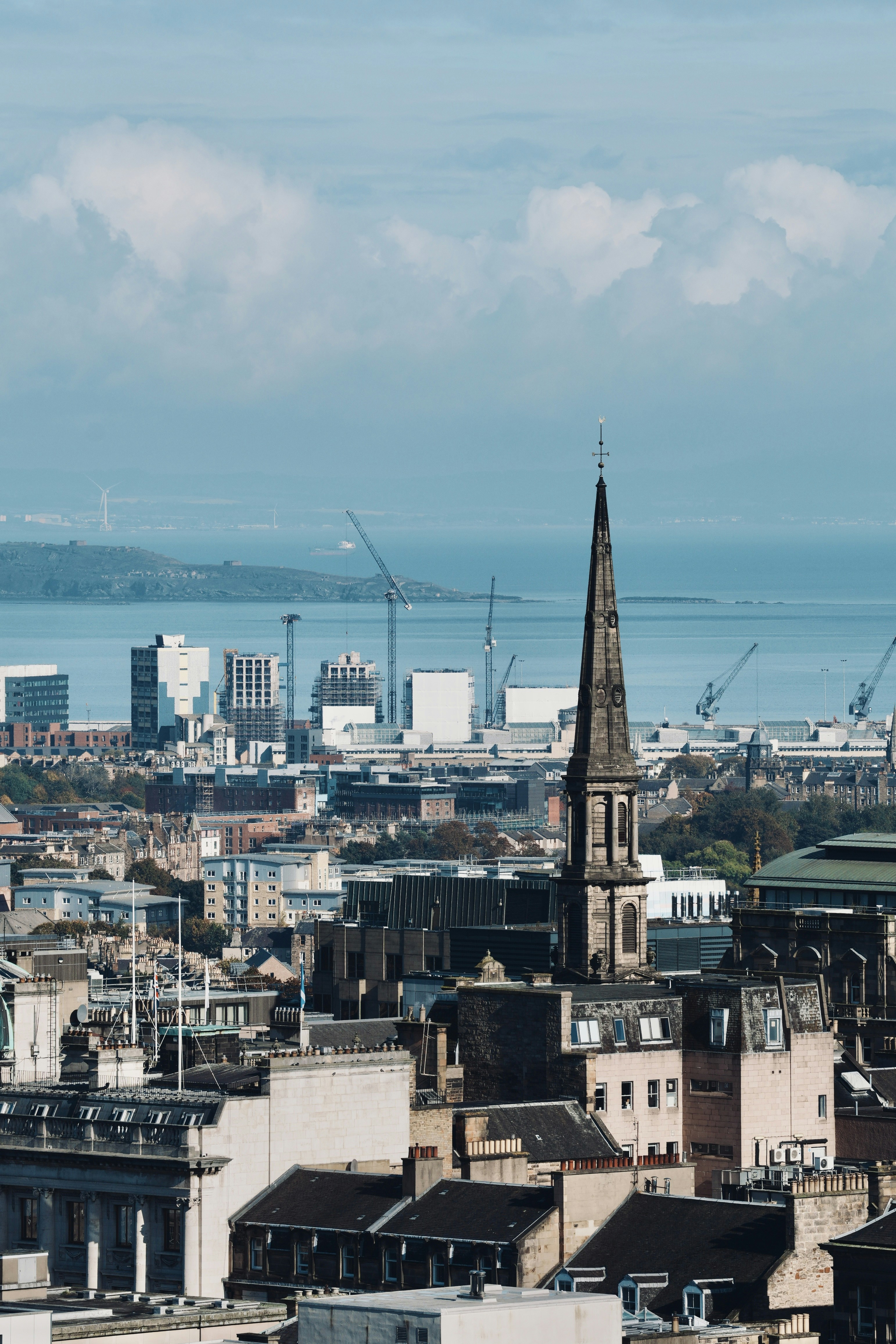Stone Spire Over a Sea of Rooftops