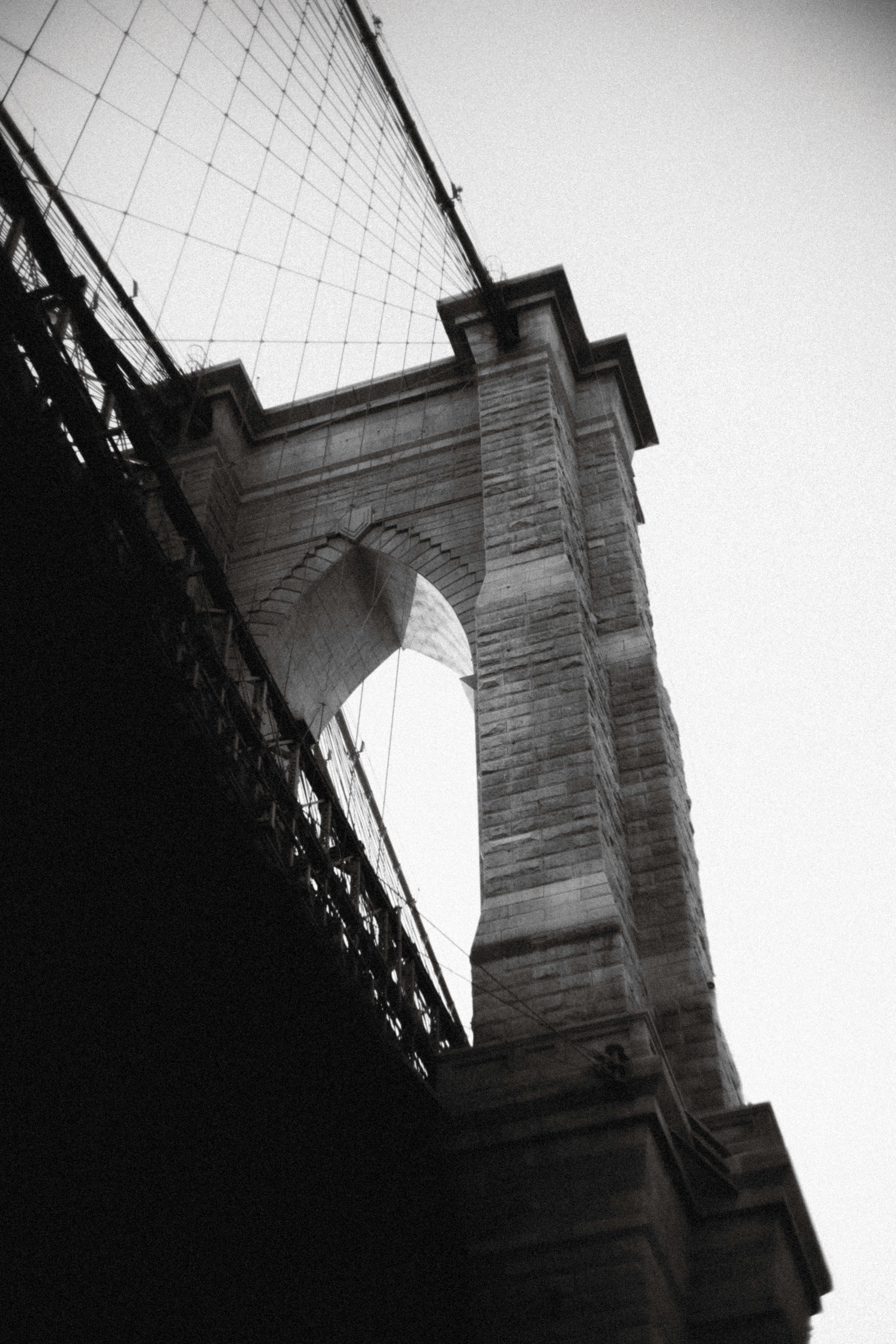 Low-Angle Monochrome: The Stone Arch and Its Taut Cables