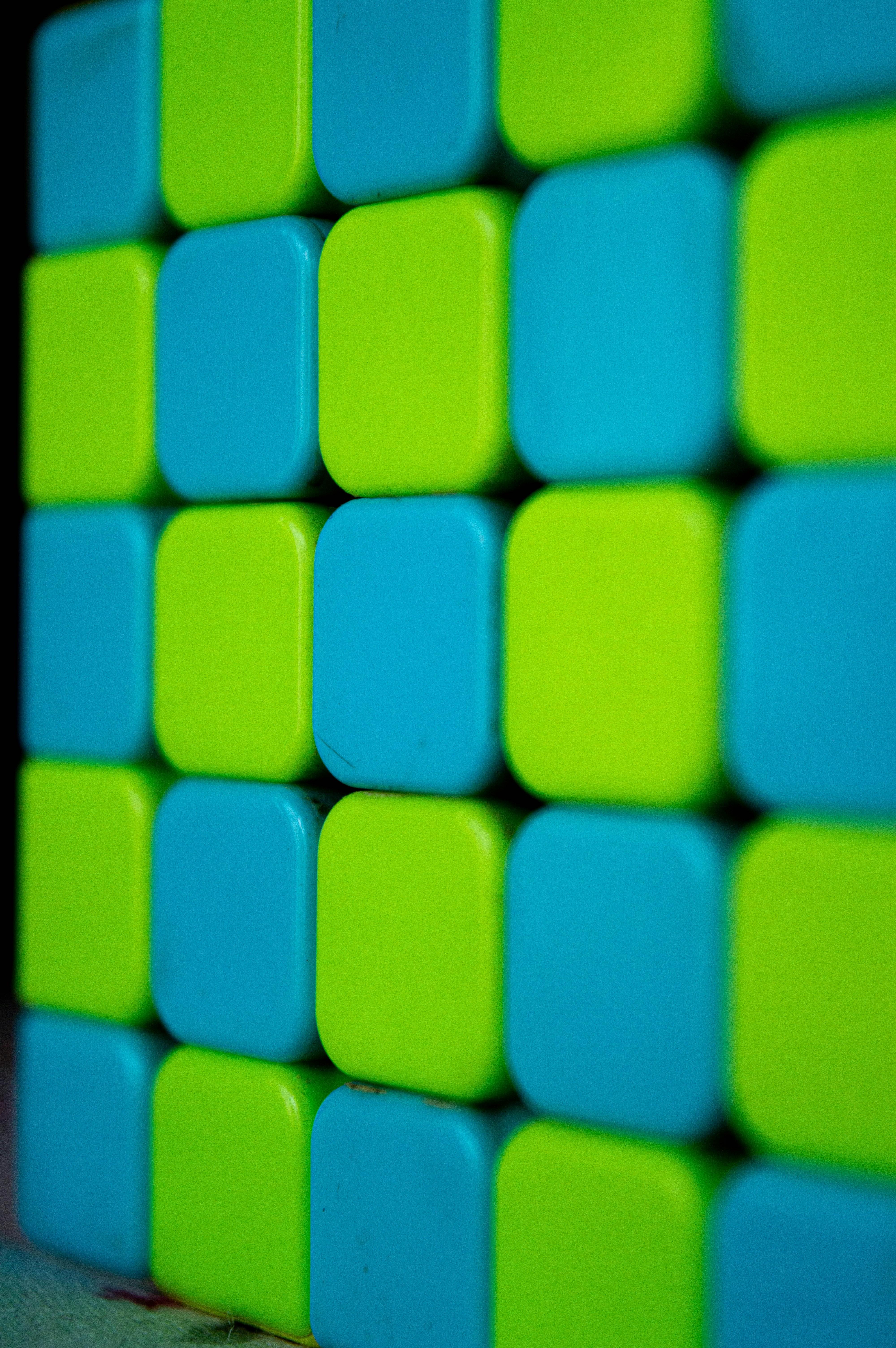 Neon Cube Mosaic: Macro Portrait of Cyan and Lime Tiles