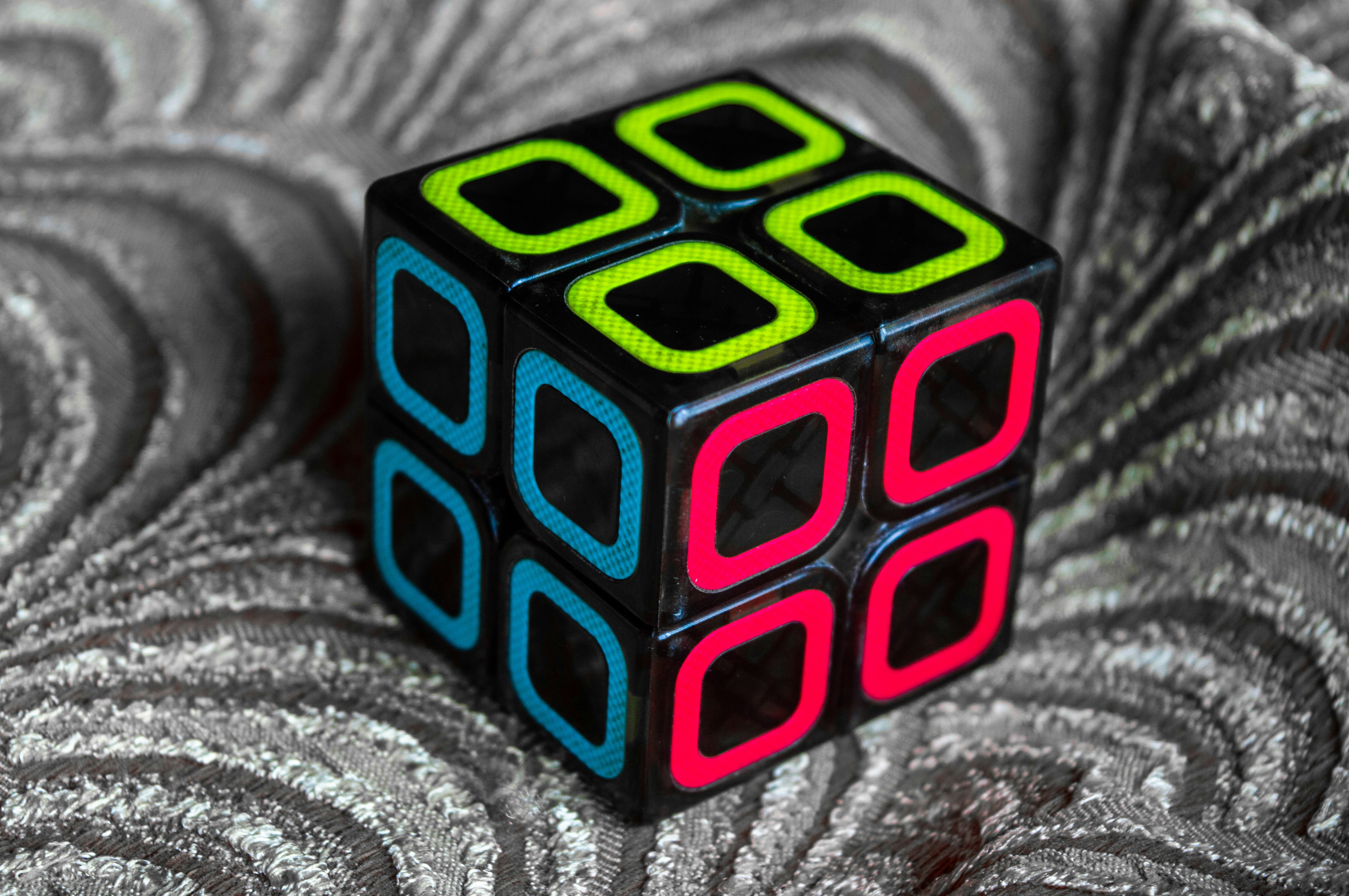 A colorful cube sitting on top of a bed photo – Free Asthetic Image on ...