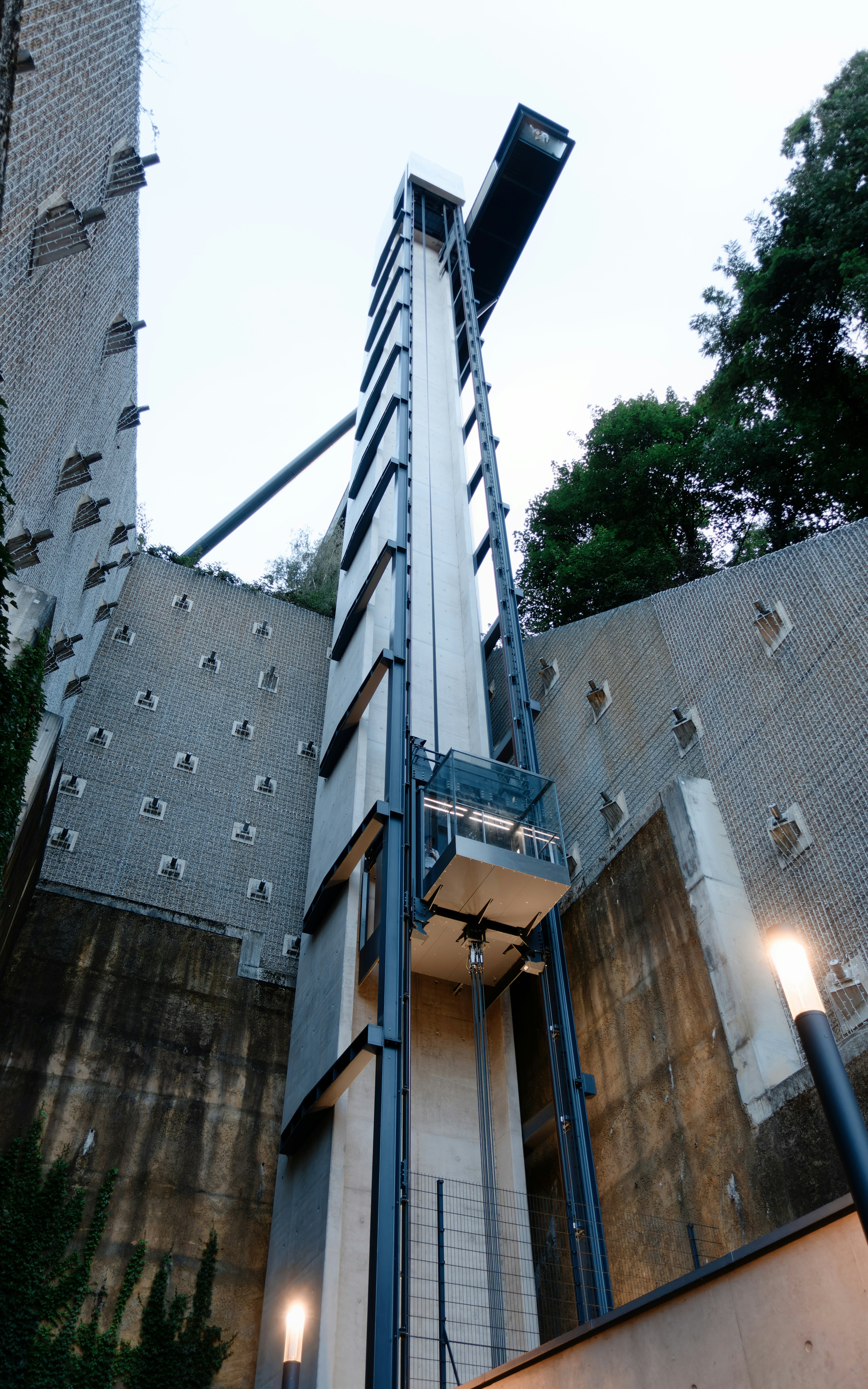 A tall building with a clock on the side of it photo – Free Pafendall ...