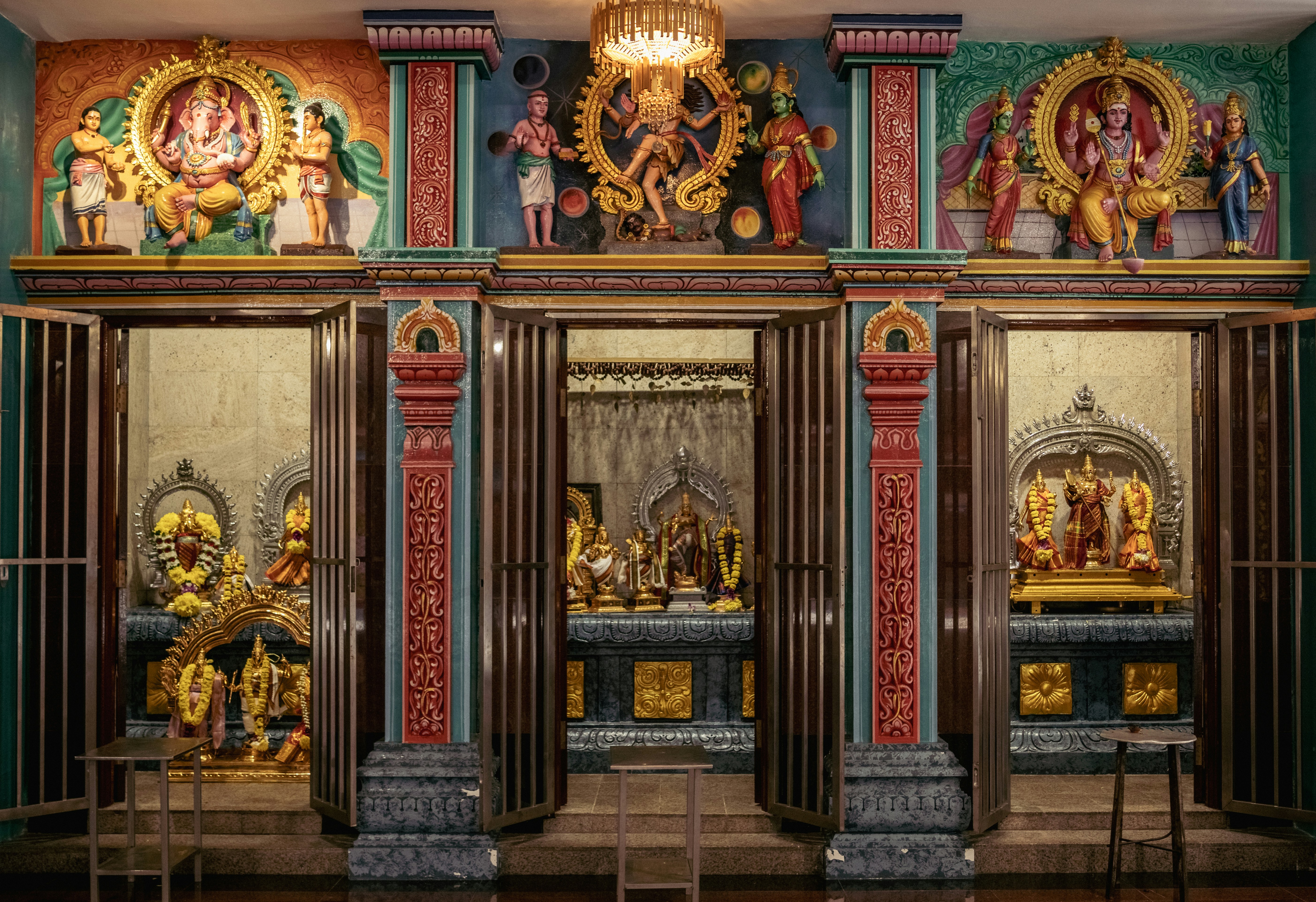 Elaborate statues and colorful carvings within a Hindu temple in Kuala Lumpur.