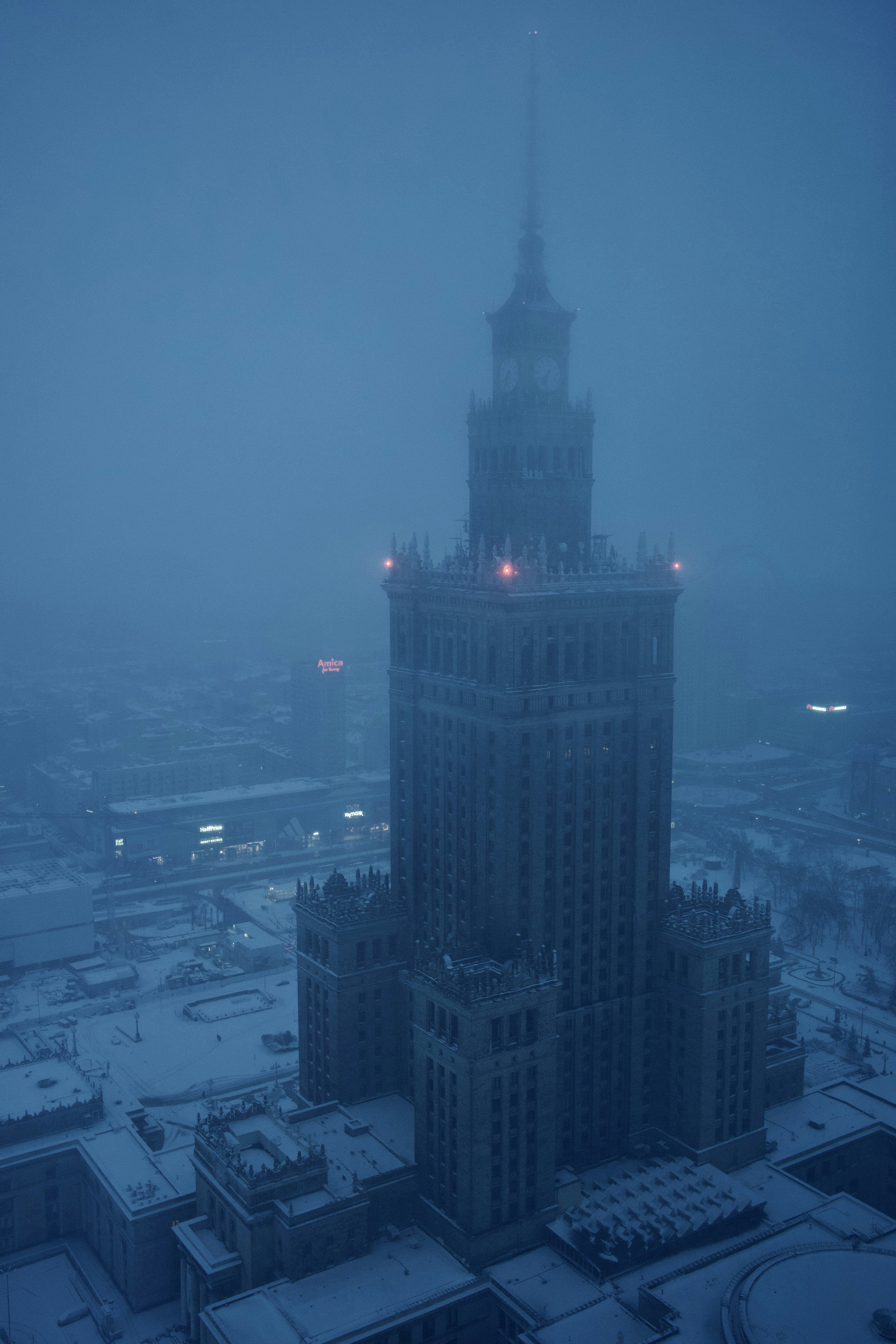 Snowbound Spire Pierces the Pale Blue Mist