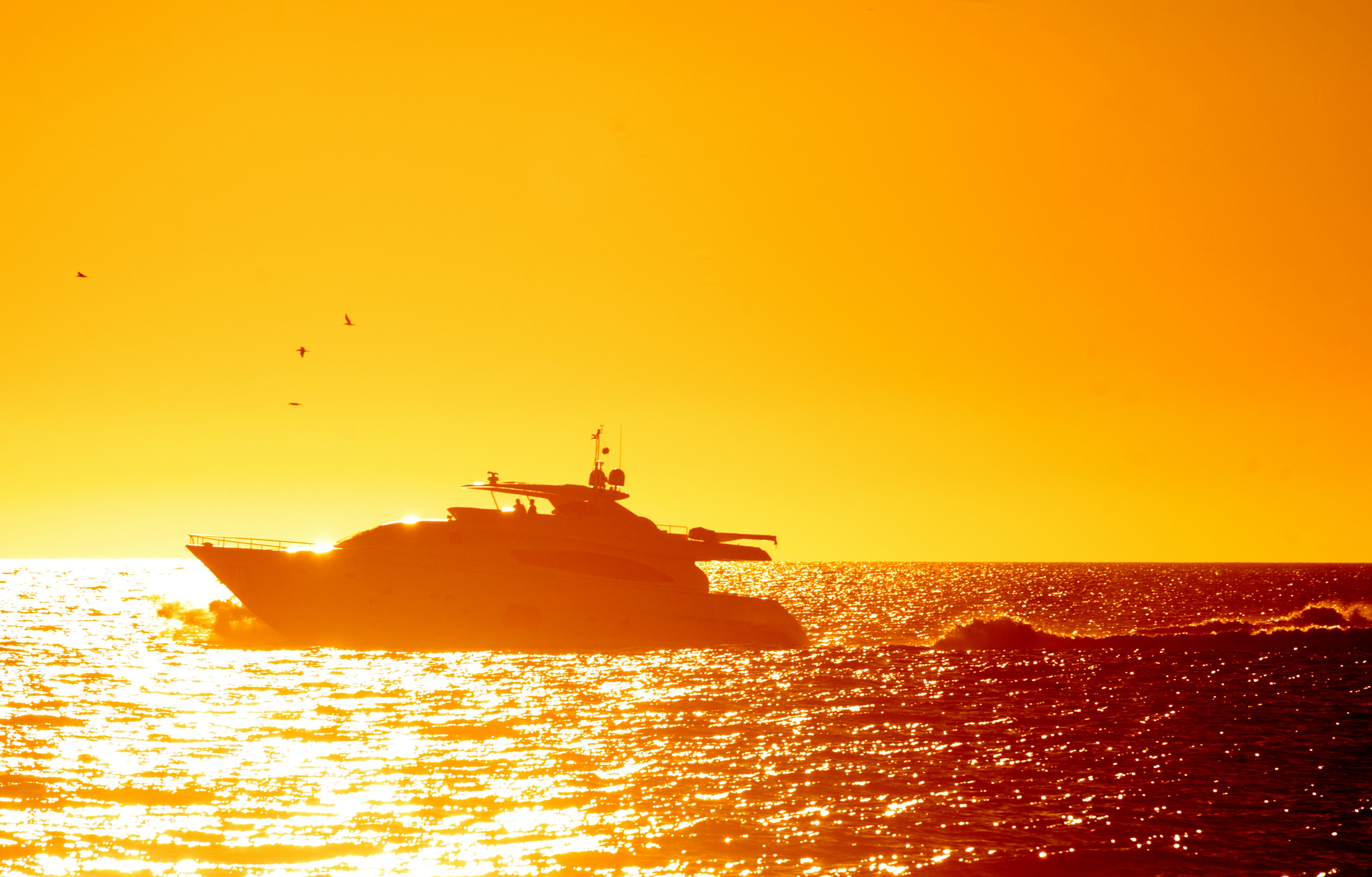 Yacht silhouette on sunset