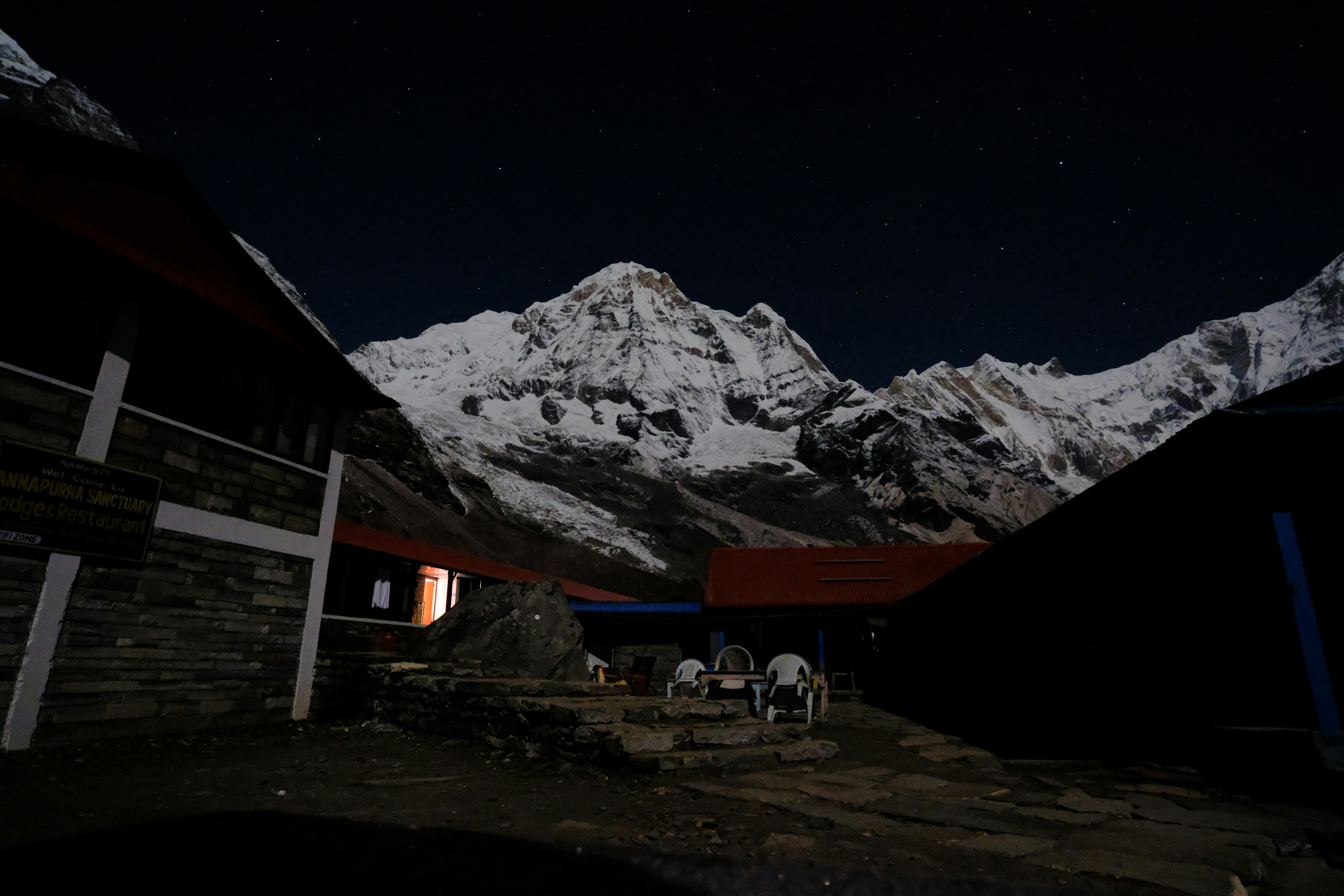 Moonlit Monoliths: Snowbound Peaks Beyond a Quiet Alpine Camp