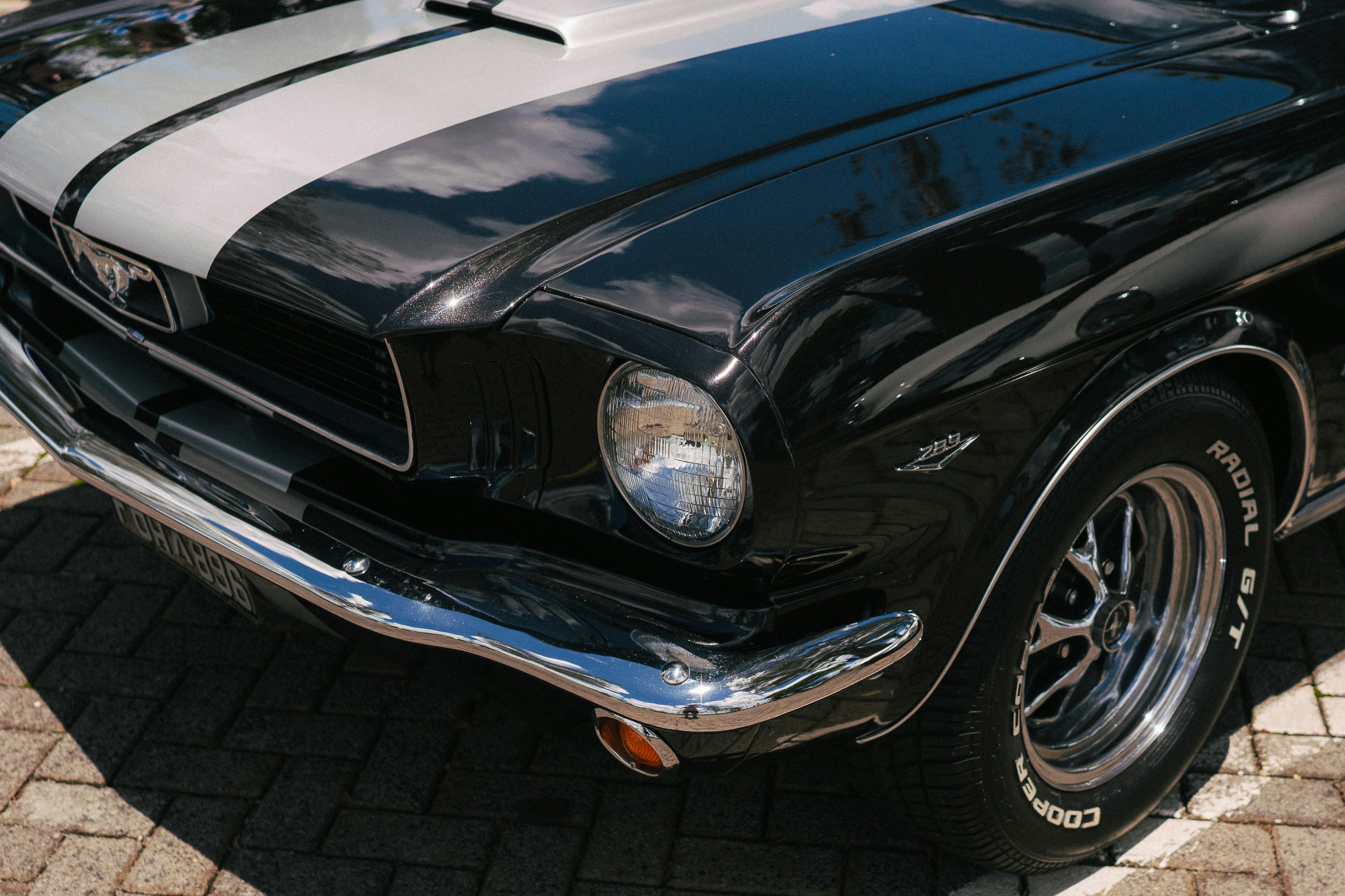 A black and white mustang parked in a parking lot photo – Free Santa ...