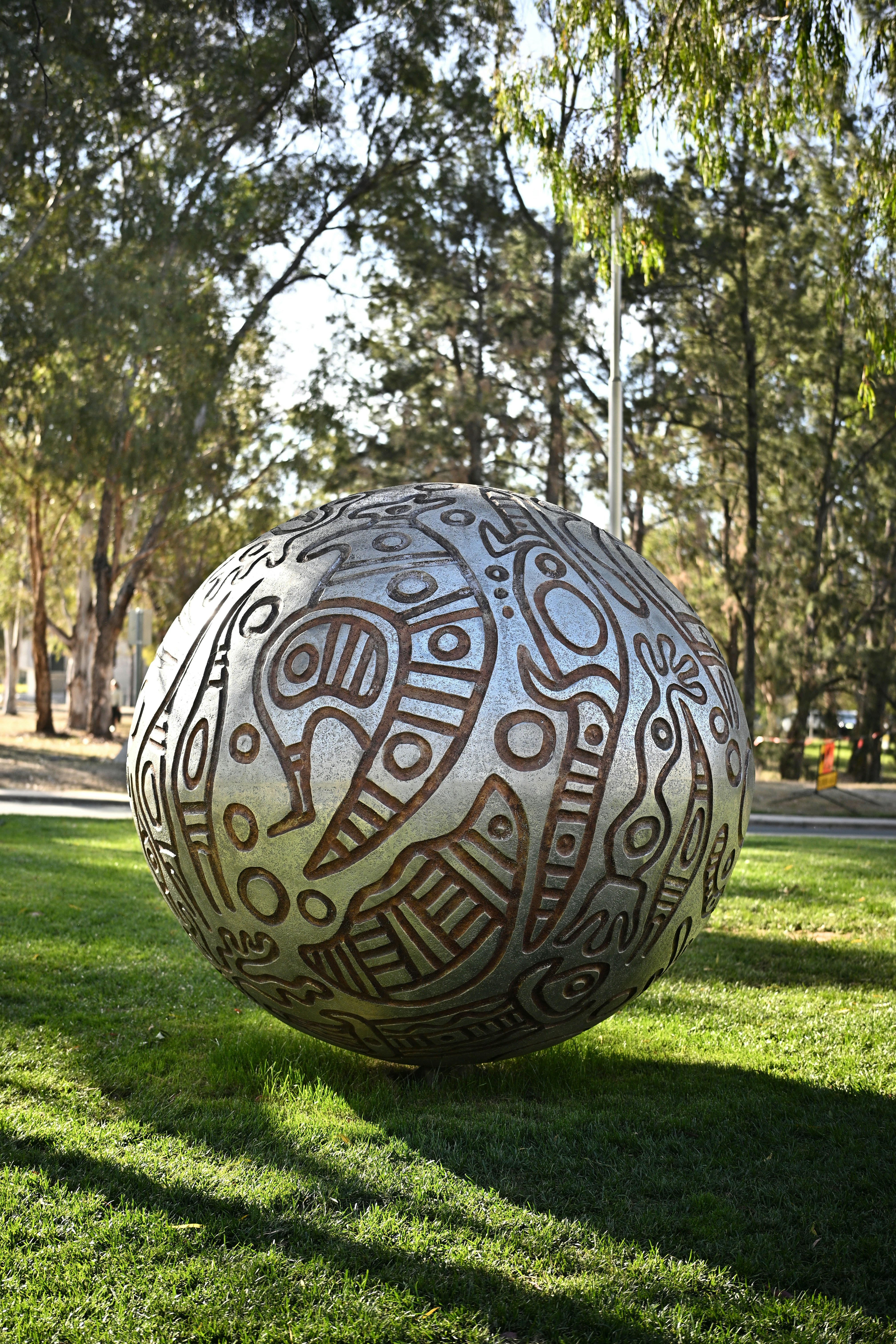 Glyph-Laced Orb in a Sunlit Park