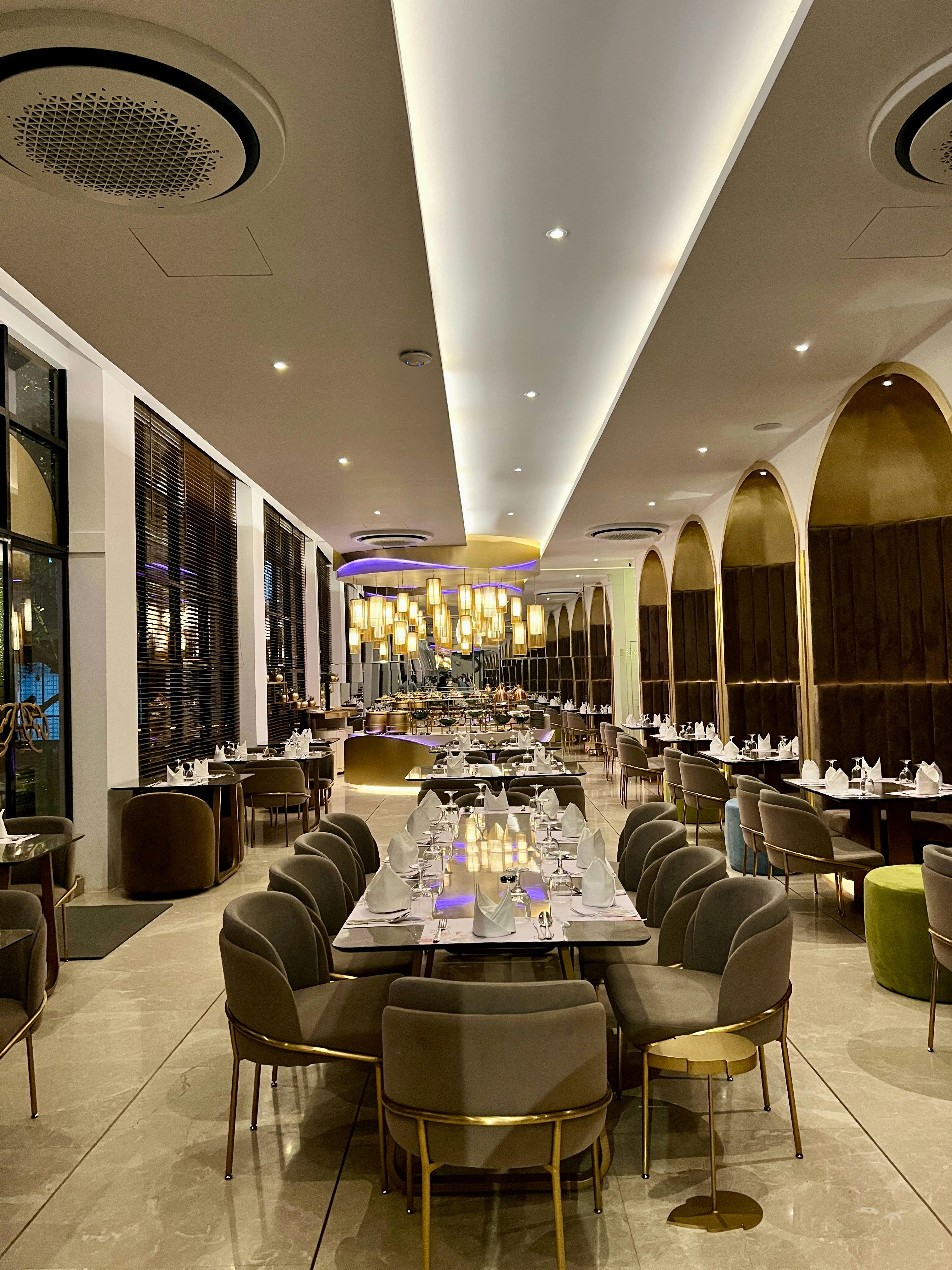 A large dining room with tables and chairs photo – Free Human Image on ...