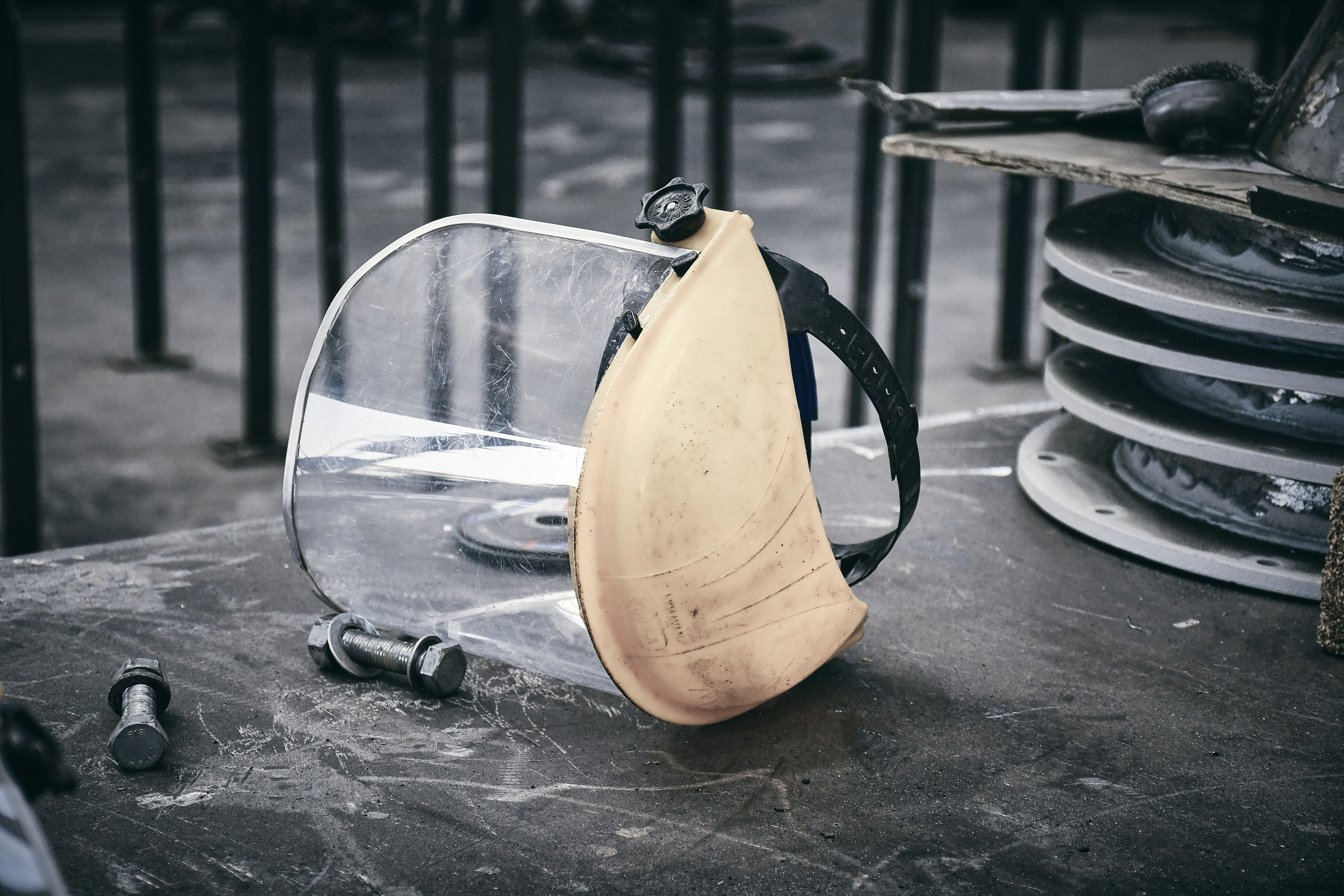 Goggles Resting Among Rust and Dust on a Weathered Workbench