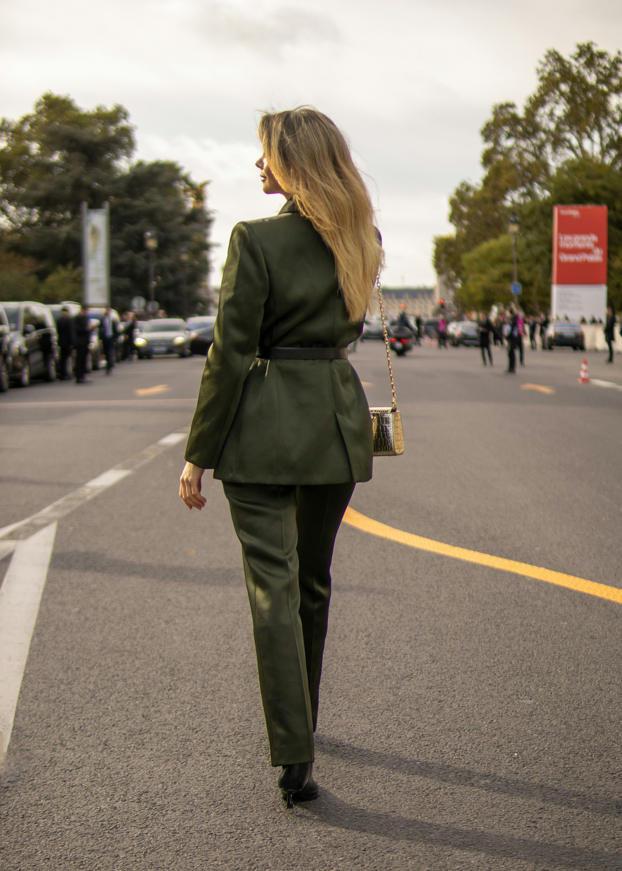 Stride of Confidence: A Green-Suited Walk Through the Boulevard