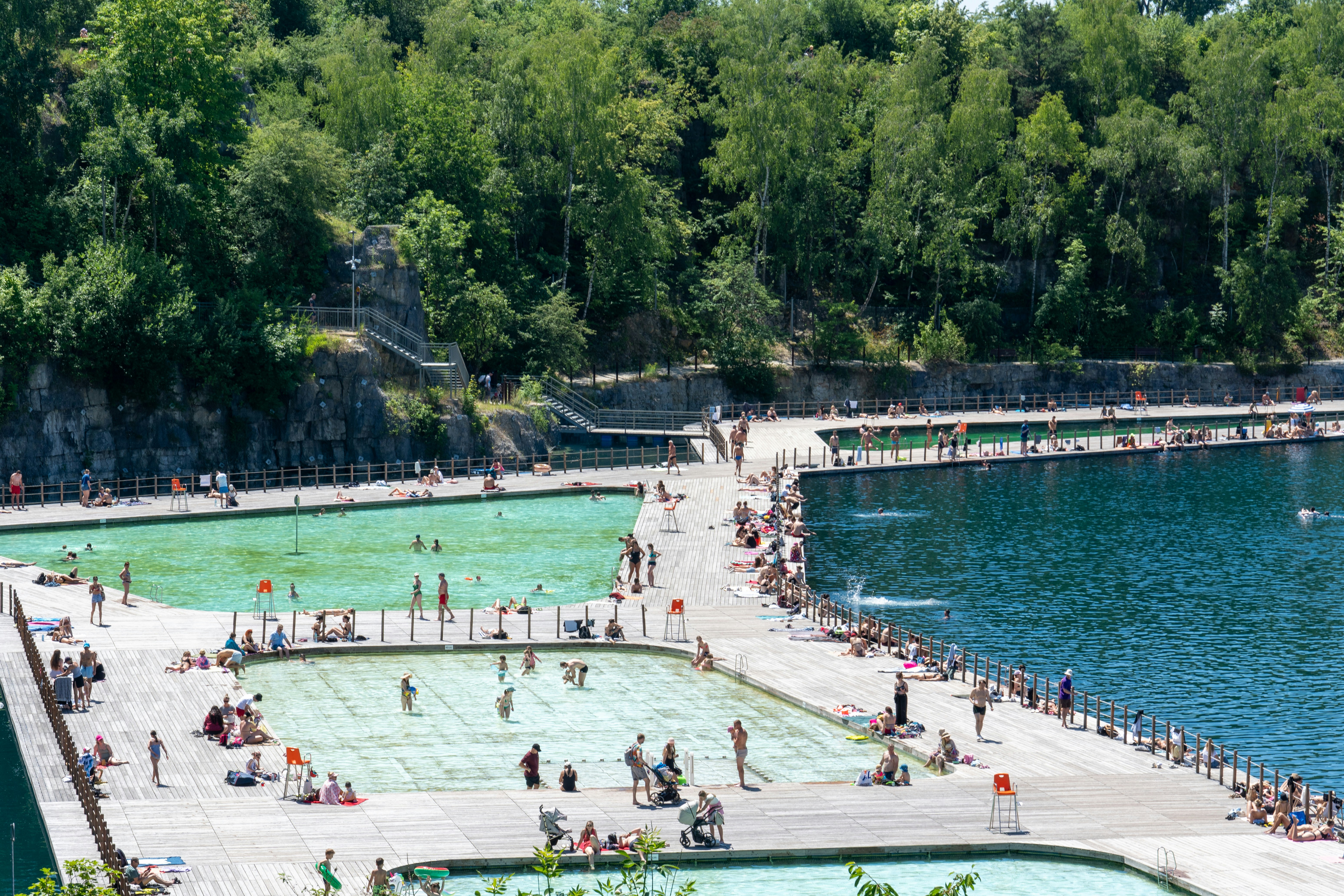 Terraced Poolscape: Turquoise Water Framed by Pines