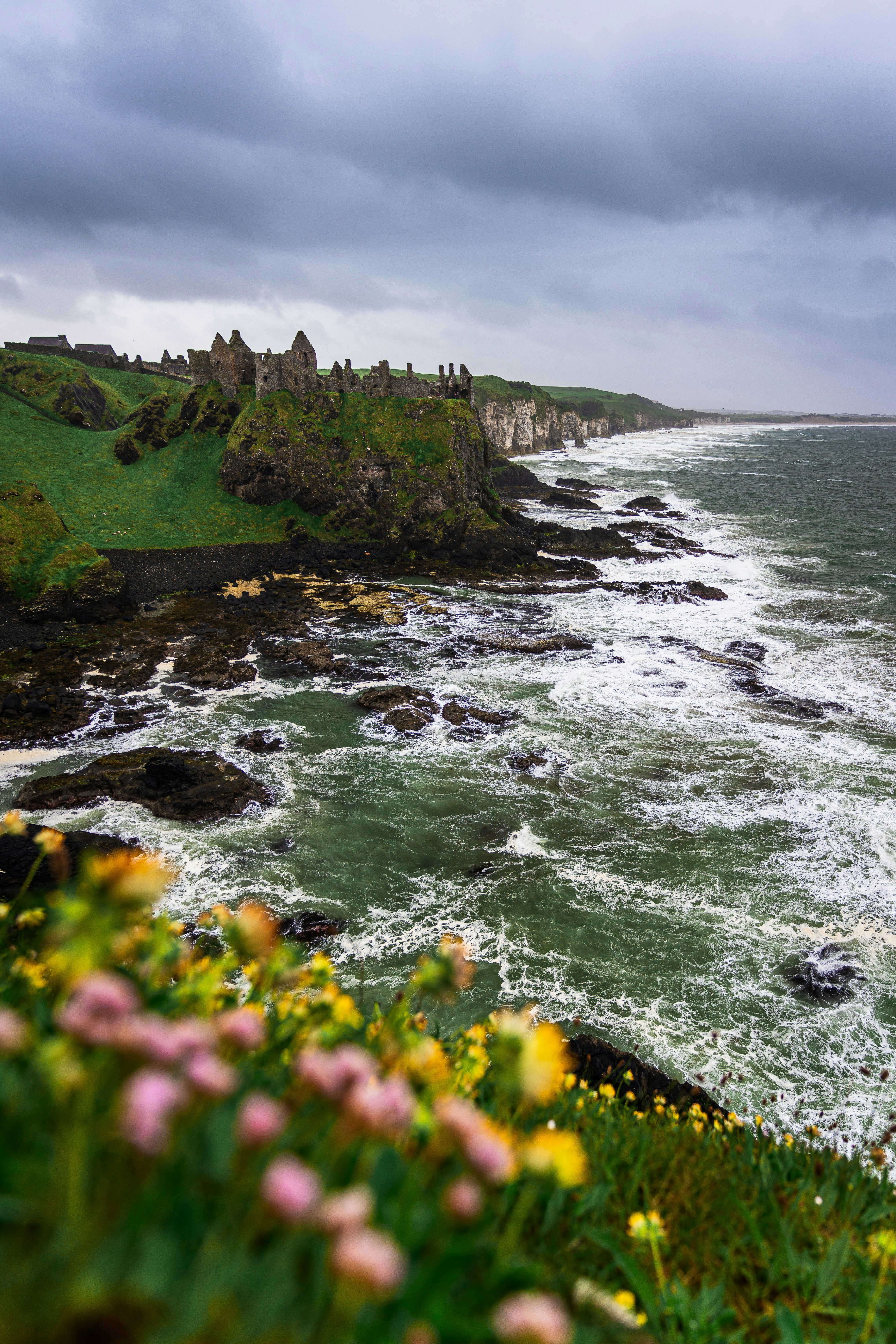 Ruined Monarchy of Cliffside: Fortifications Amidst Surf and Sea Mist