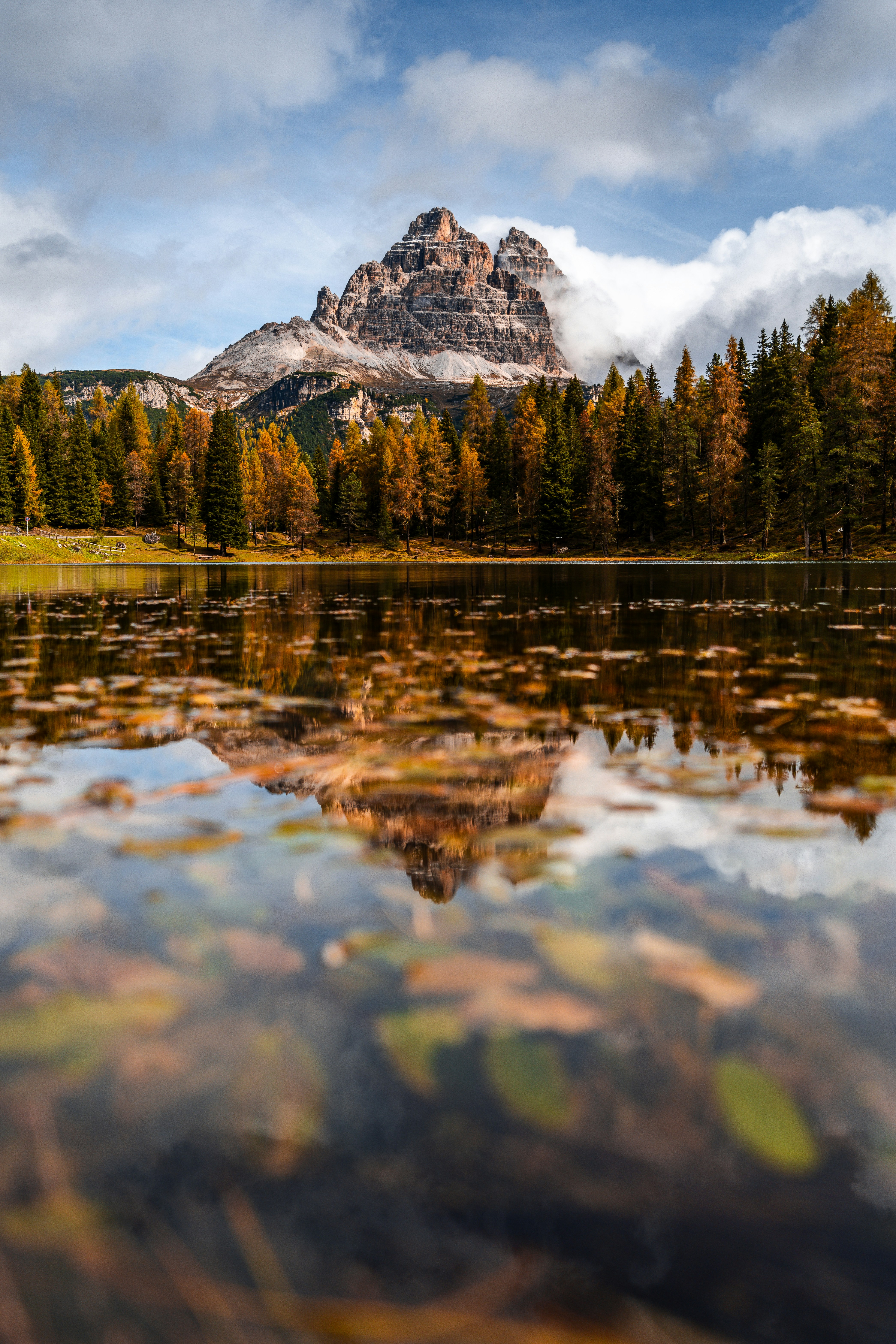 A mountain is reflected in the still water of a lake photo – Free ...