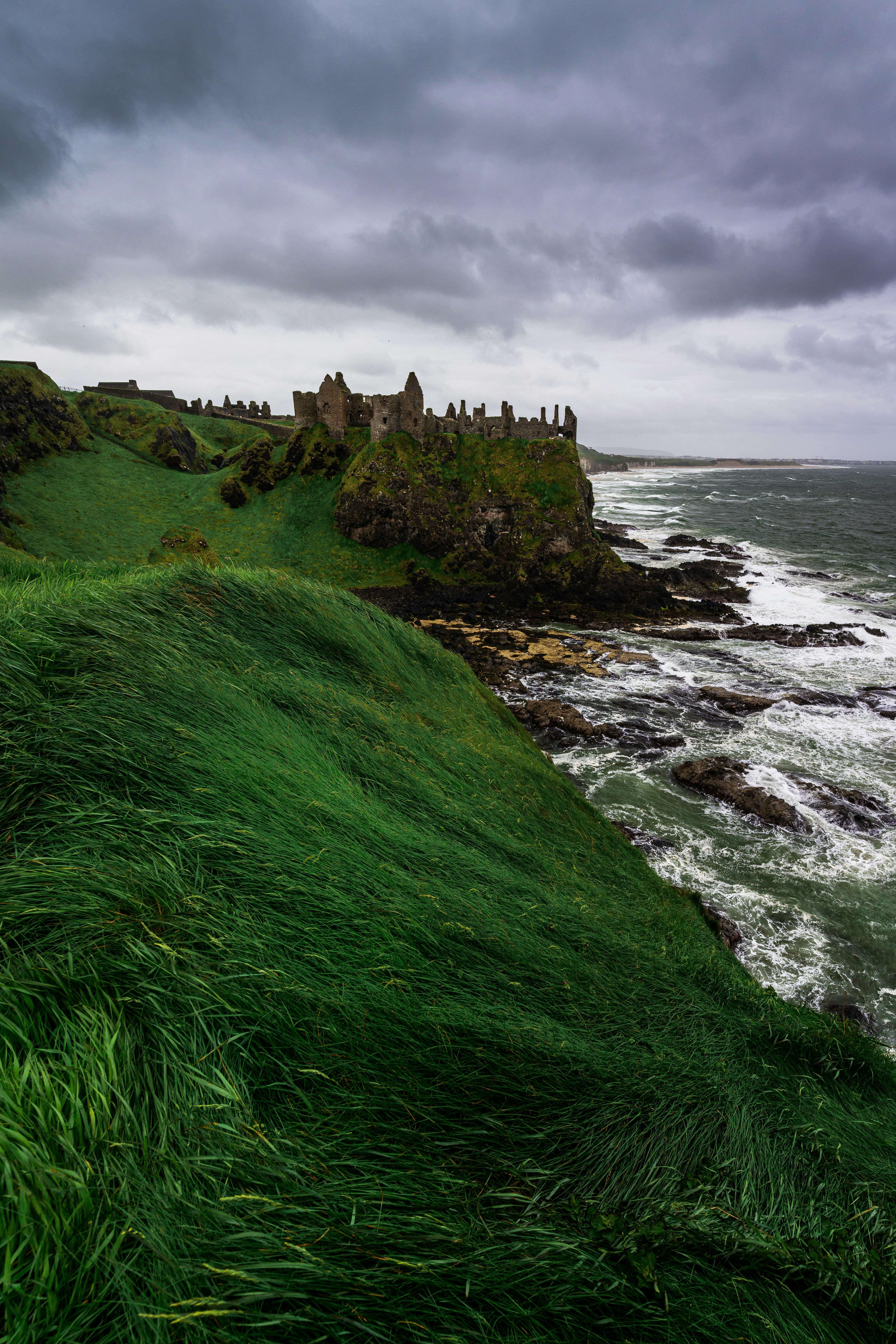Crumbled Keep at the Edge: Wind-Swept Cliff Ruins Over a Roiling Sea