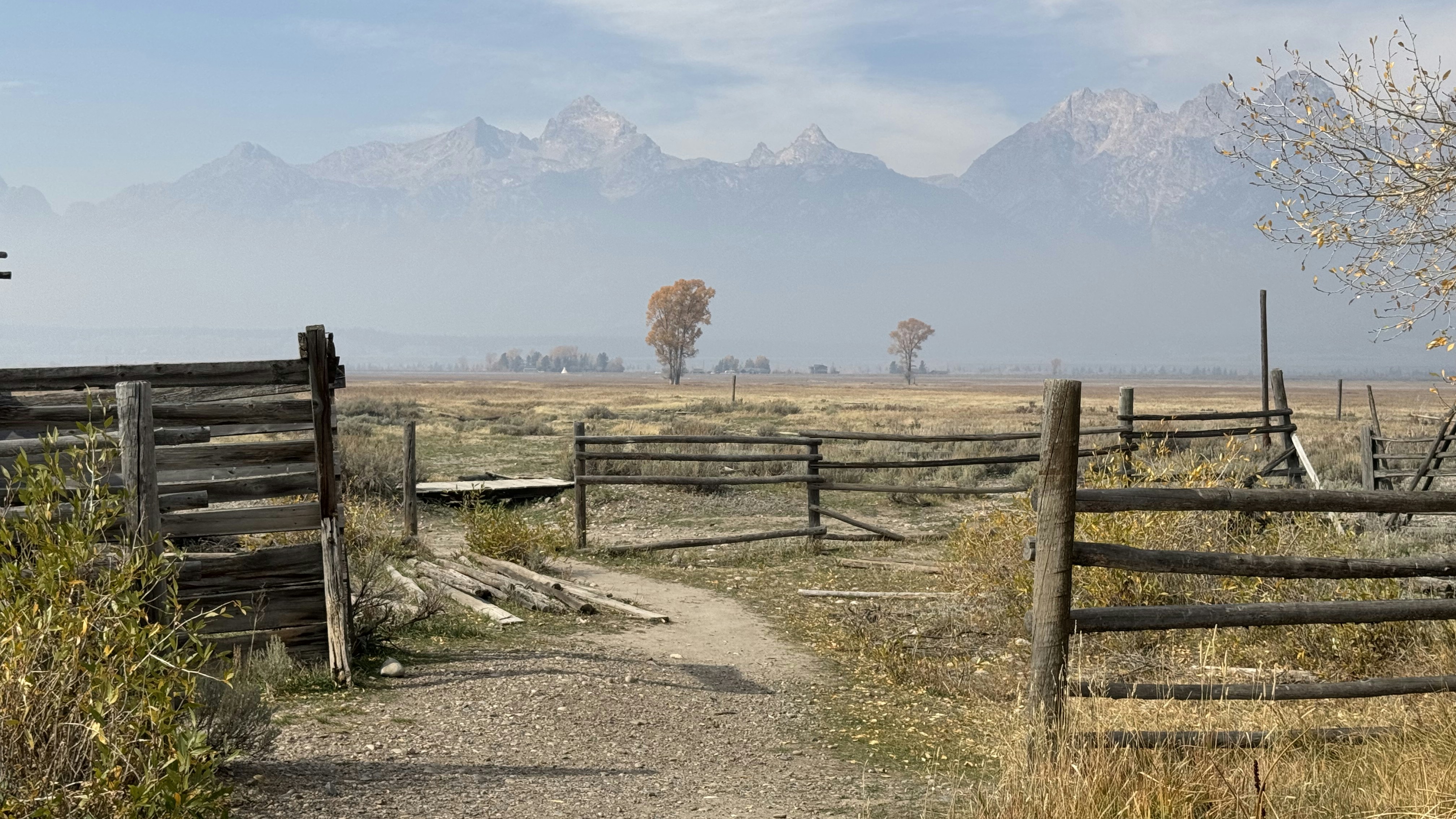 A dirt path leading to a wooden fence photo – Free Mormon row Image on ...