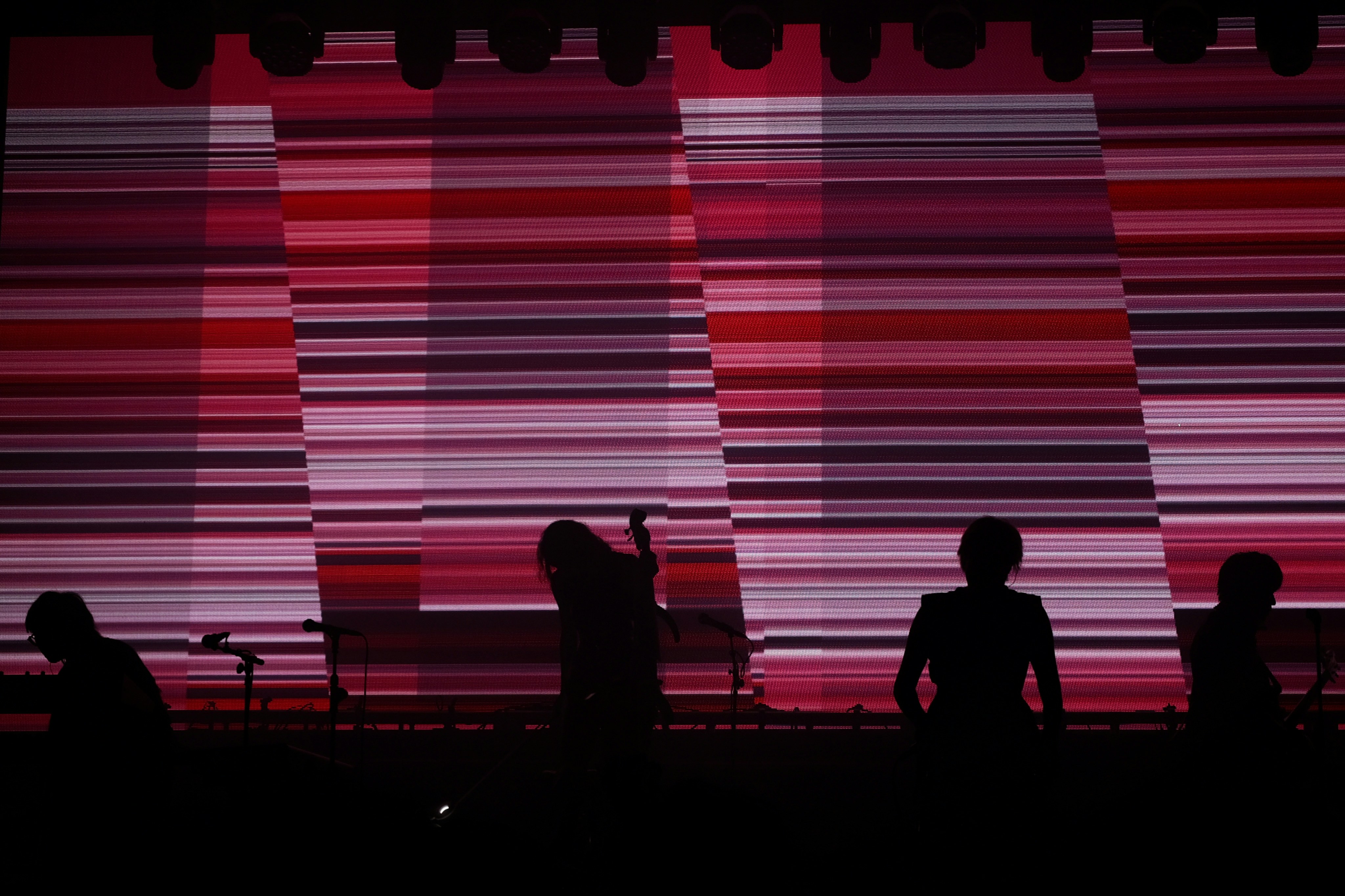 Neon Stripes Frame a Band's Silhouette