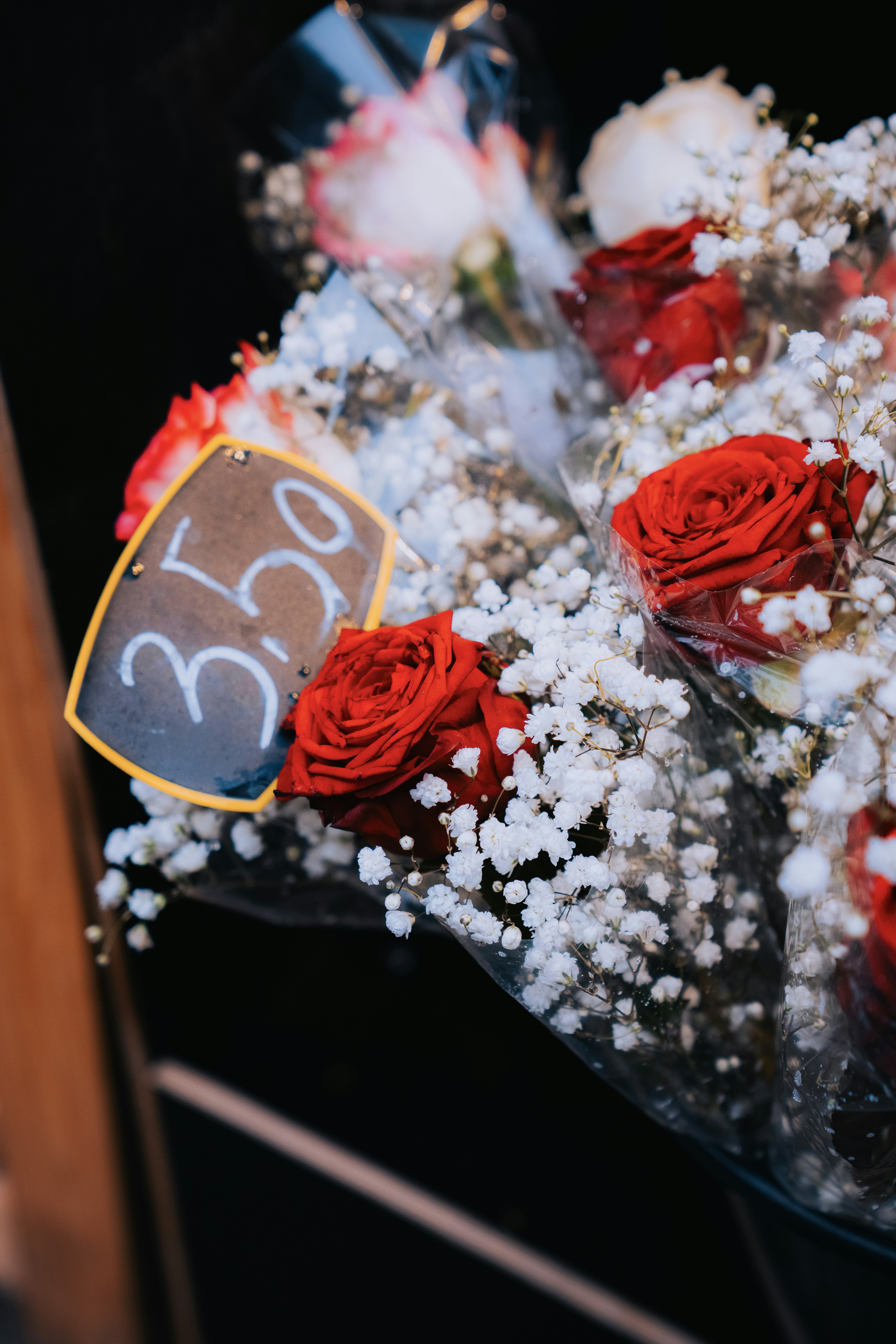 A bouquet of red roses and baby's breath