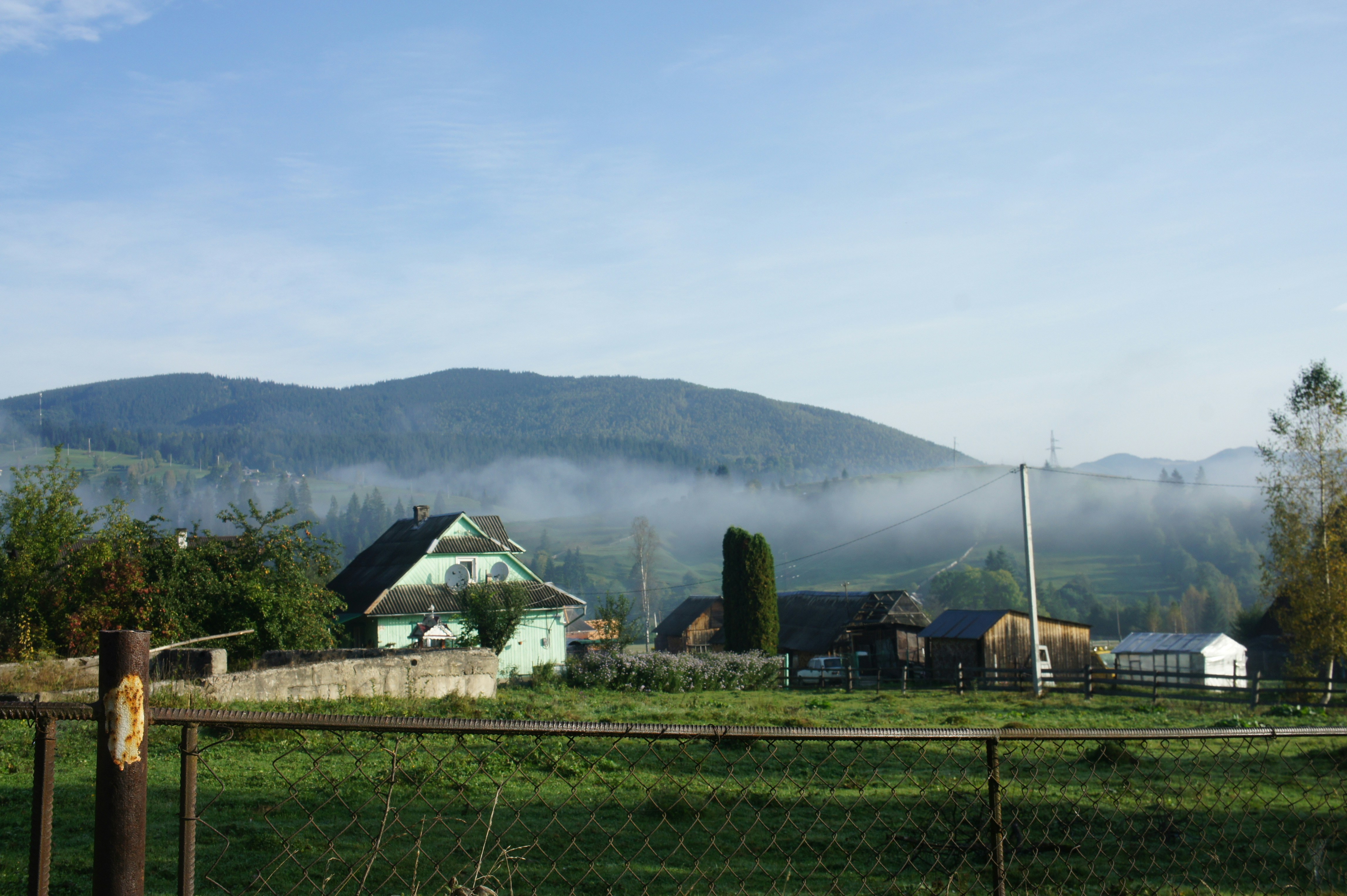 Pastoral Ridge: Morning Fog over a Quiet Village