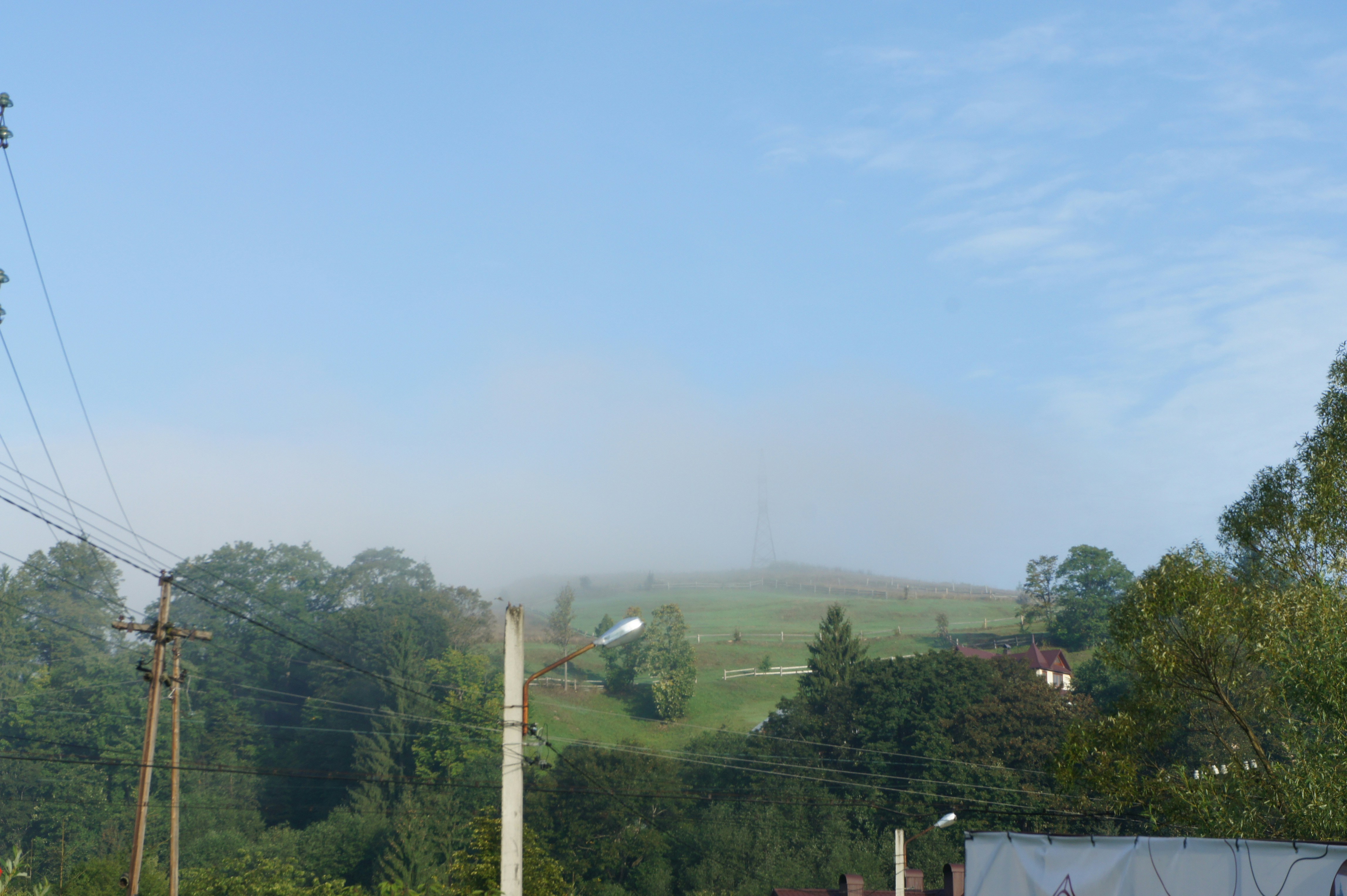 Veil of Mist Over Rolling Hills